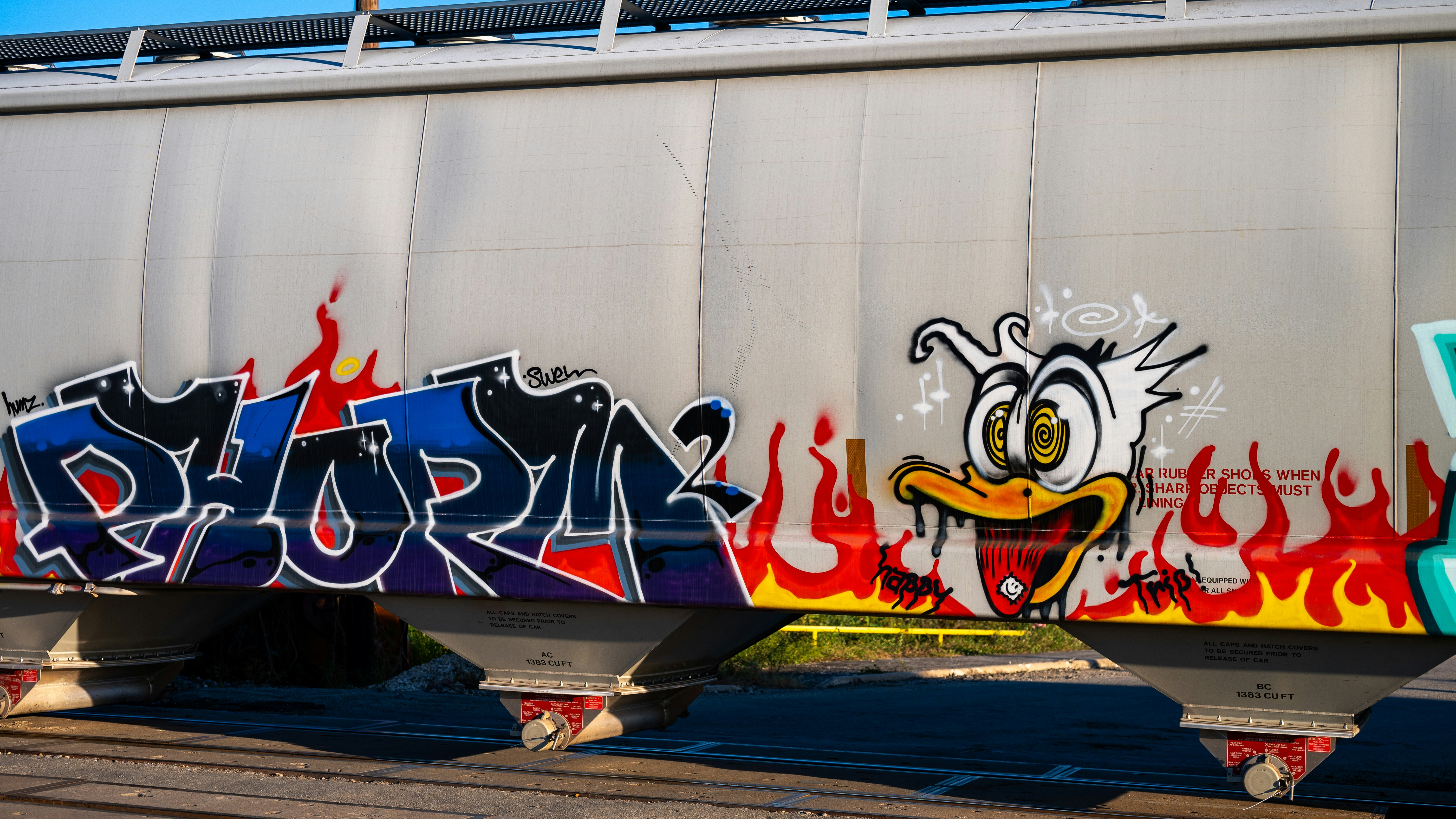 A train car covered in graffiti with a goofy face photo – Free Art ...