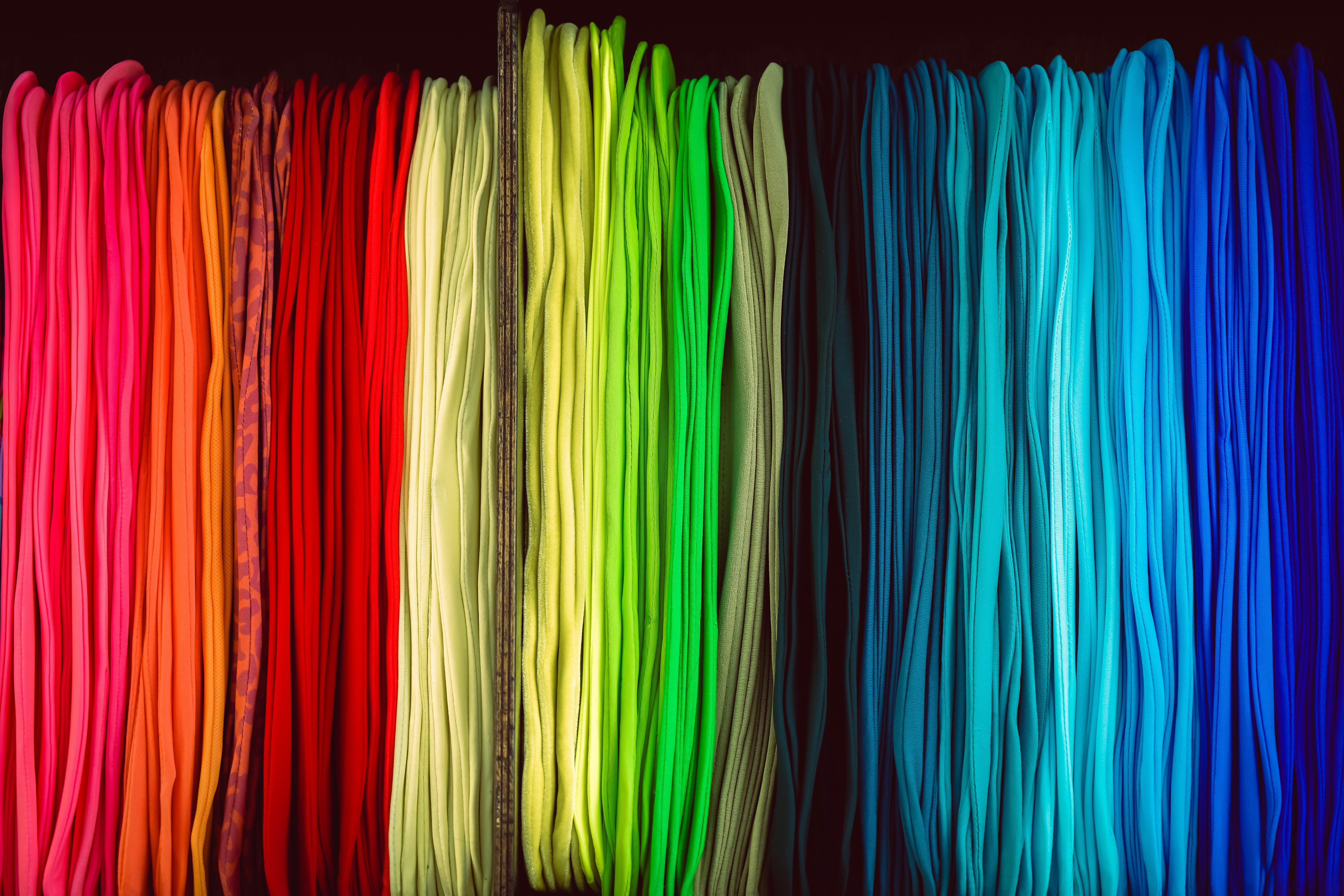 A group of rainbow colored streamers on a black background photo – Free ...