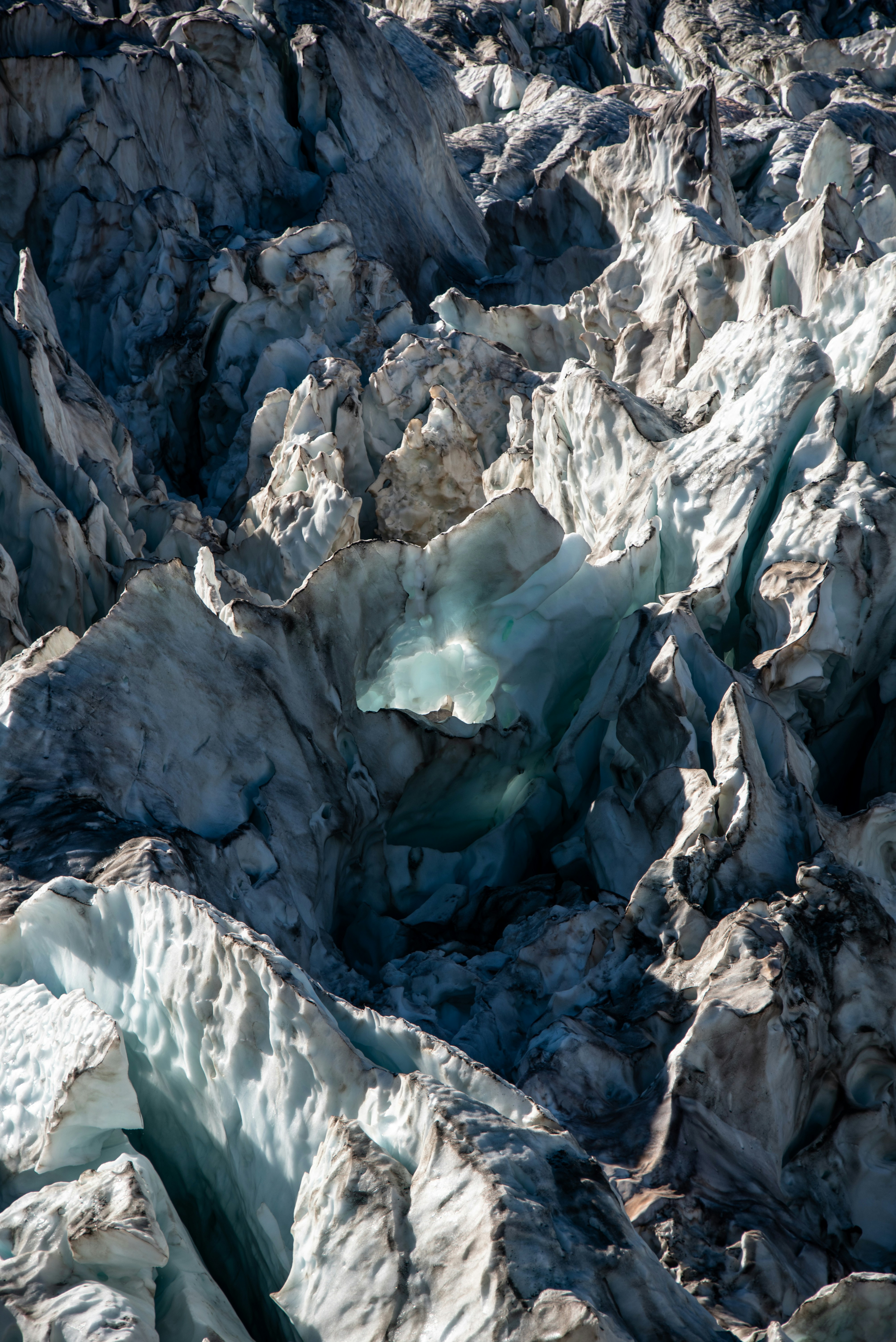 A large group of rocks with a small pool of water photo – Free Pattern ...