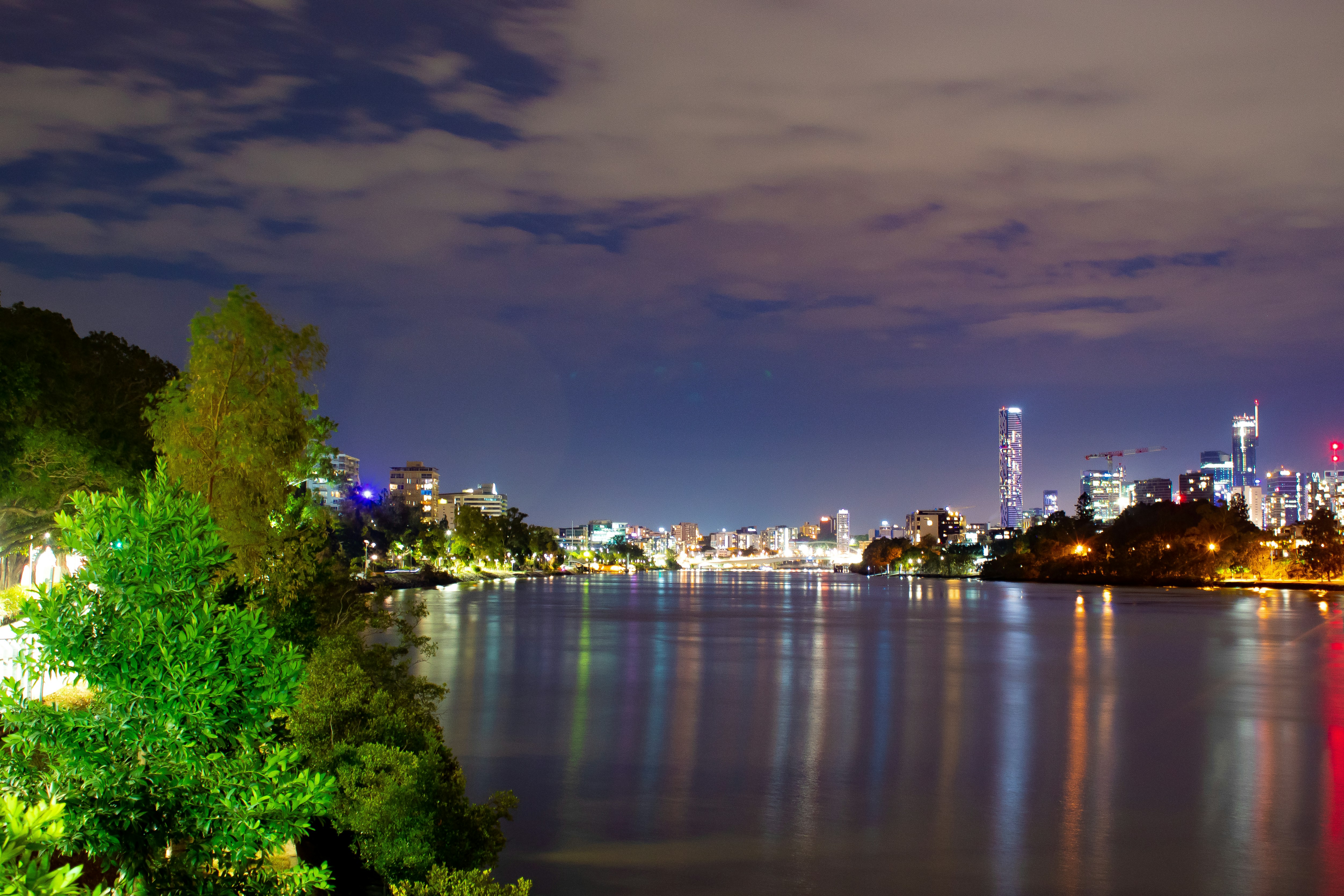 A view of the Brisbane City From Toowong at night. Brisbane Australia | A view of a city at night from across the water