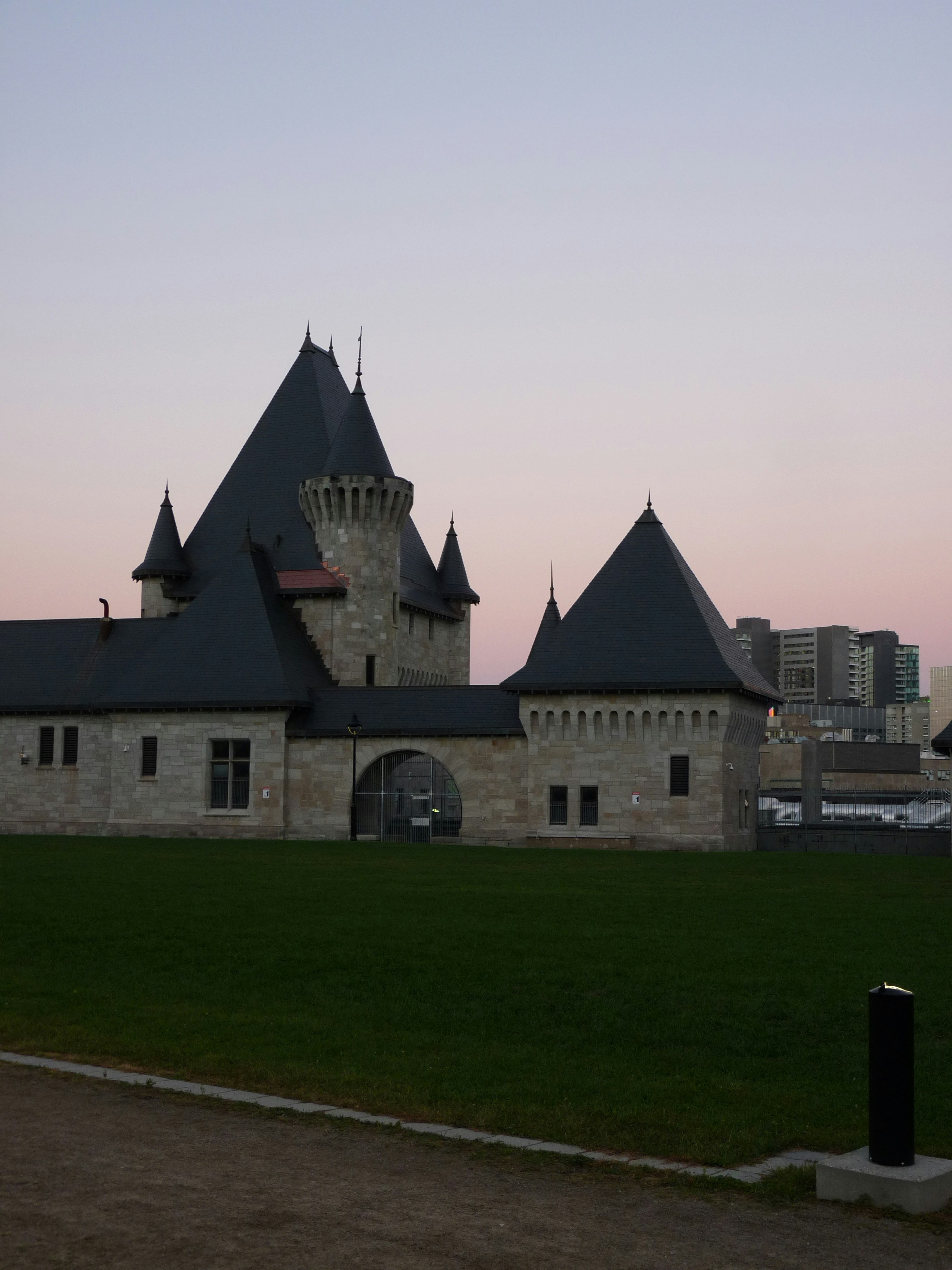 A large castle like building with a clock tower photo – Free City Image ...