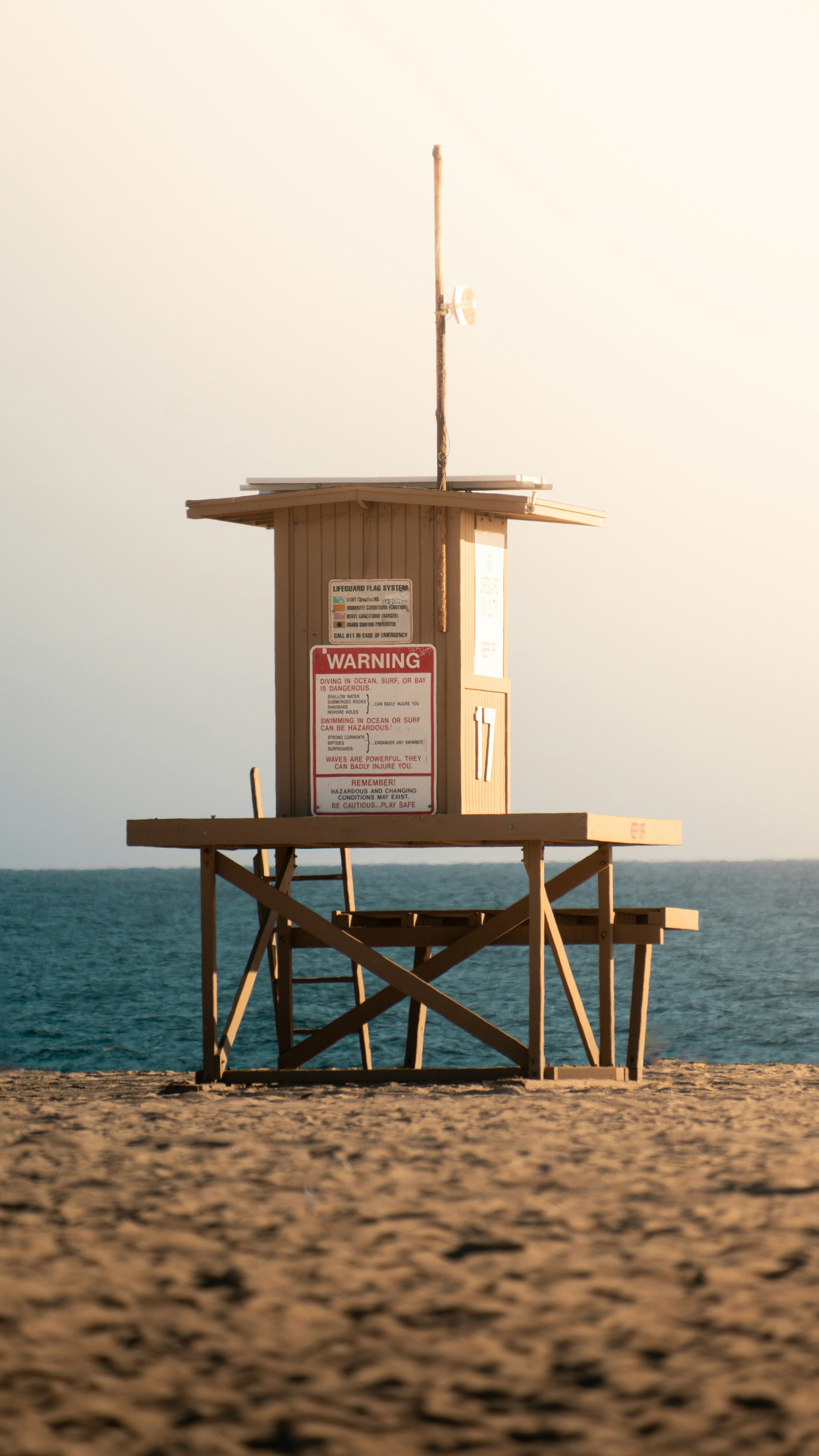 Golden-hour Sentinel: Lifeguard Tower Quietly Overlooking the Sea