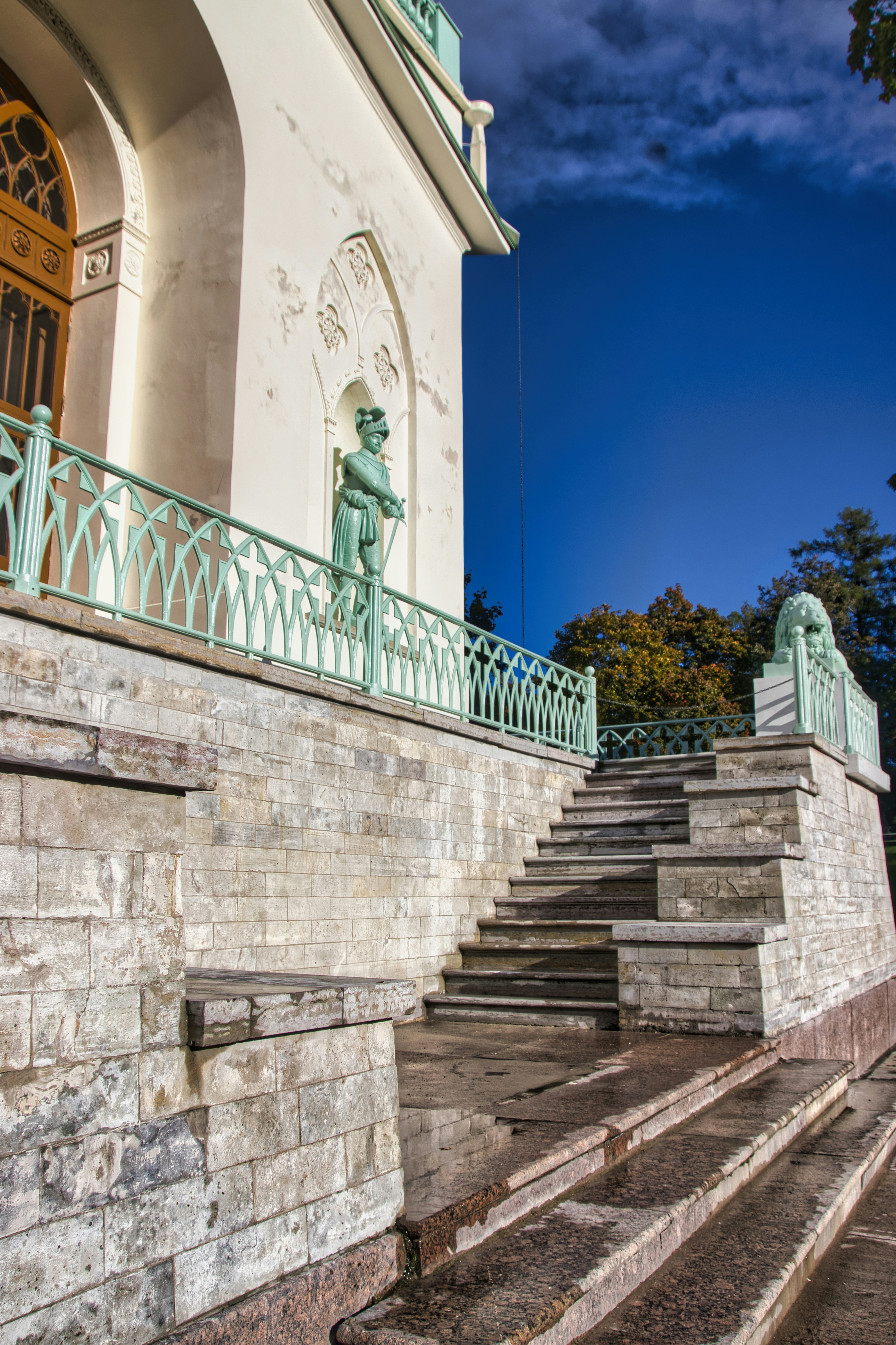 A stone building with a staircase leading up to it photo – Free ...