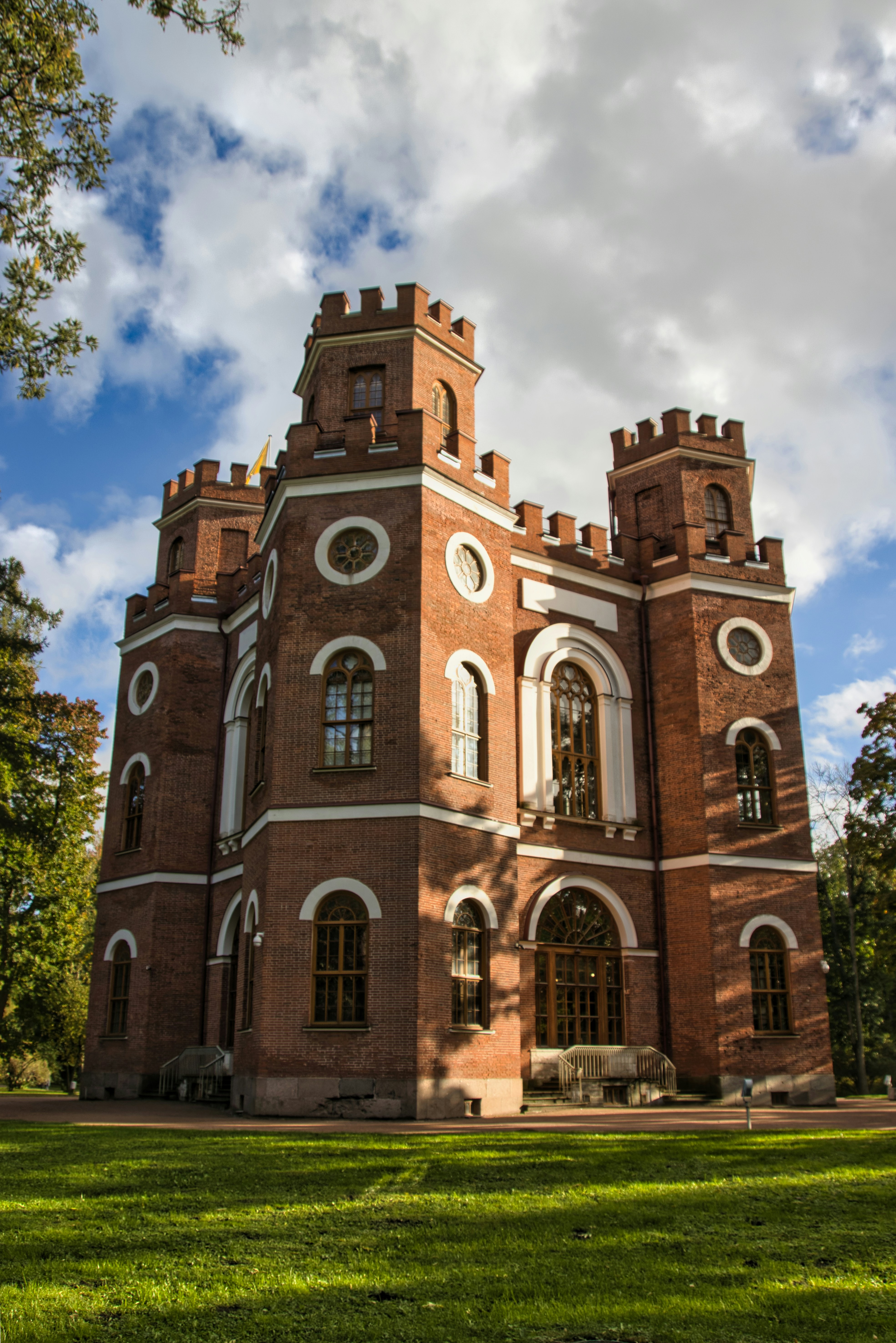 Sunlit Brick Castle: Twin Turrets Rise in a Park