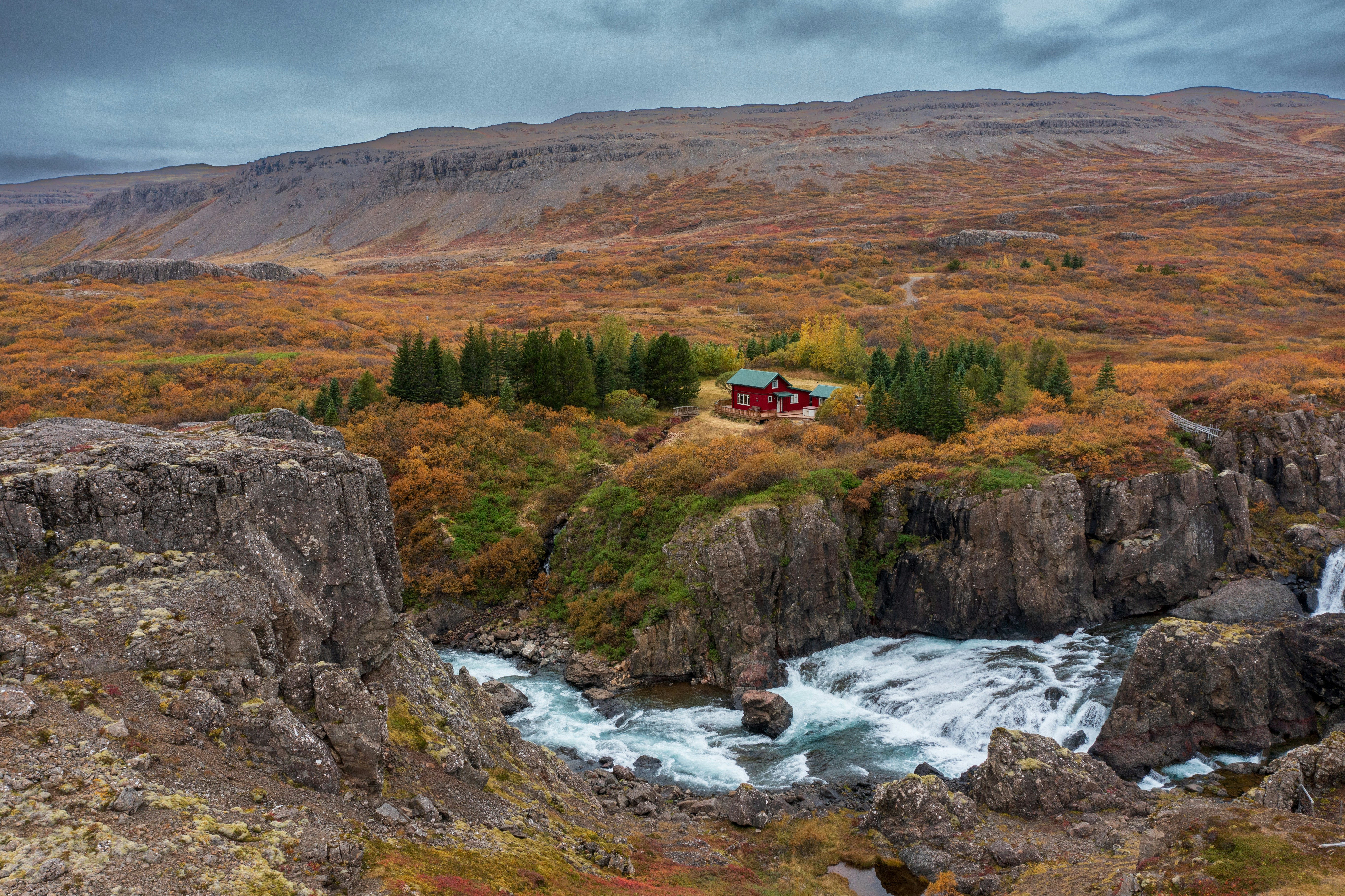 A house on a cliff overlooking a river photo – Free Iceland drone Image ...