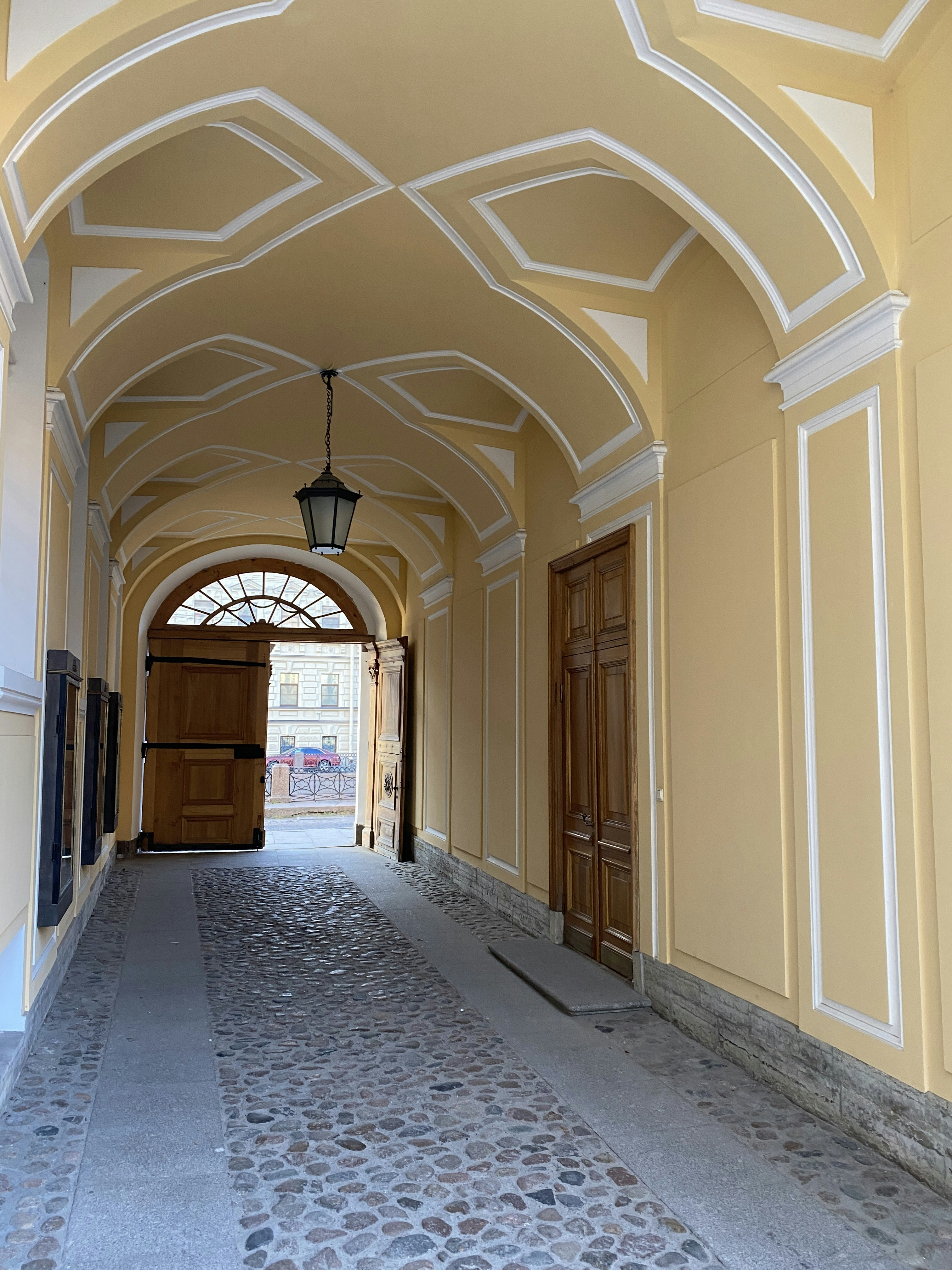 Sunlit Yellow Cloister: Archway Corridor to the Gate