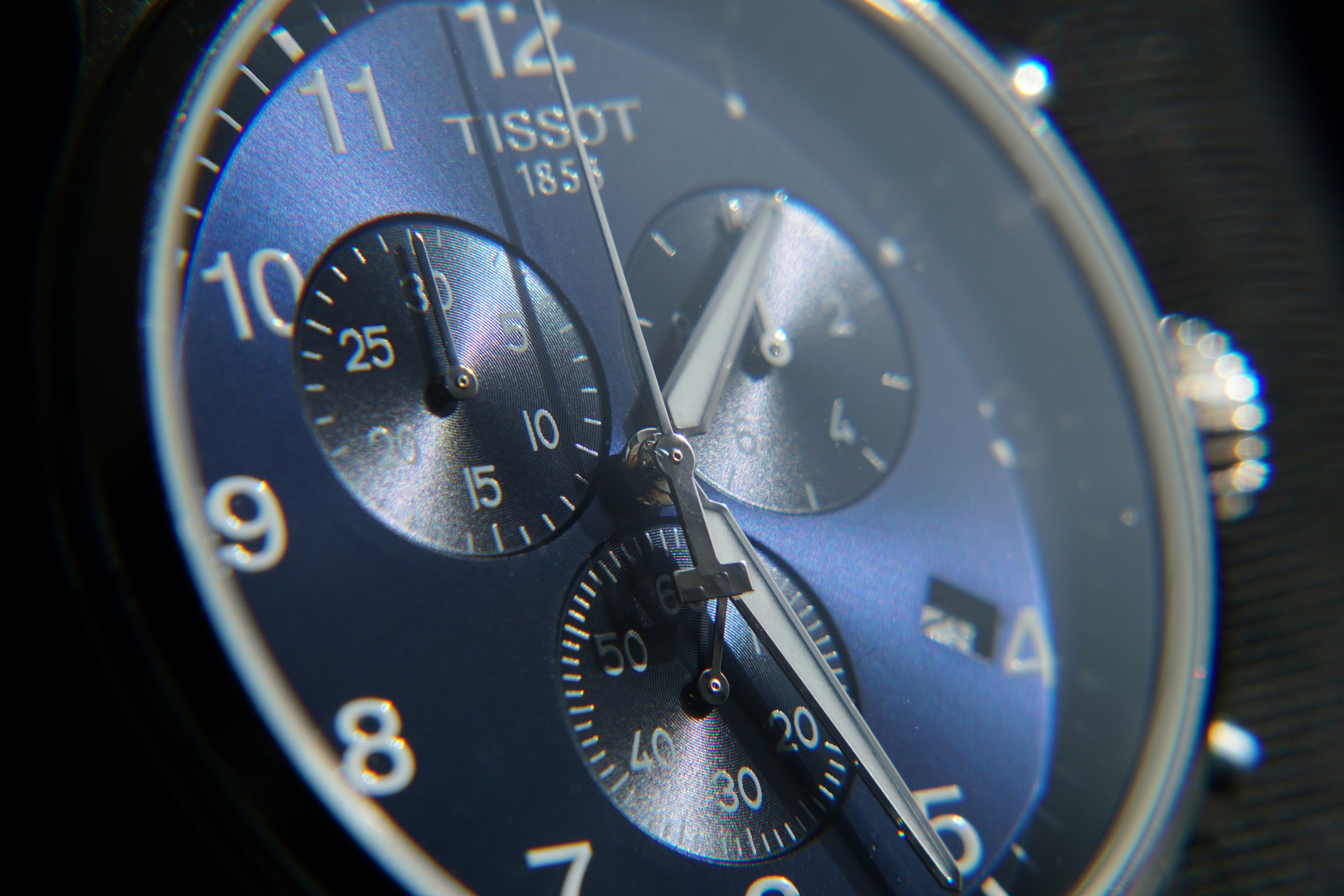 A close up of a watch on a black surface photo – Free Chronograph Image ...