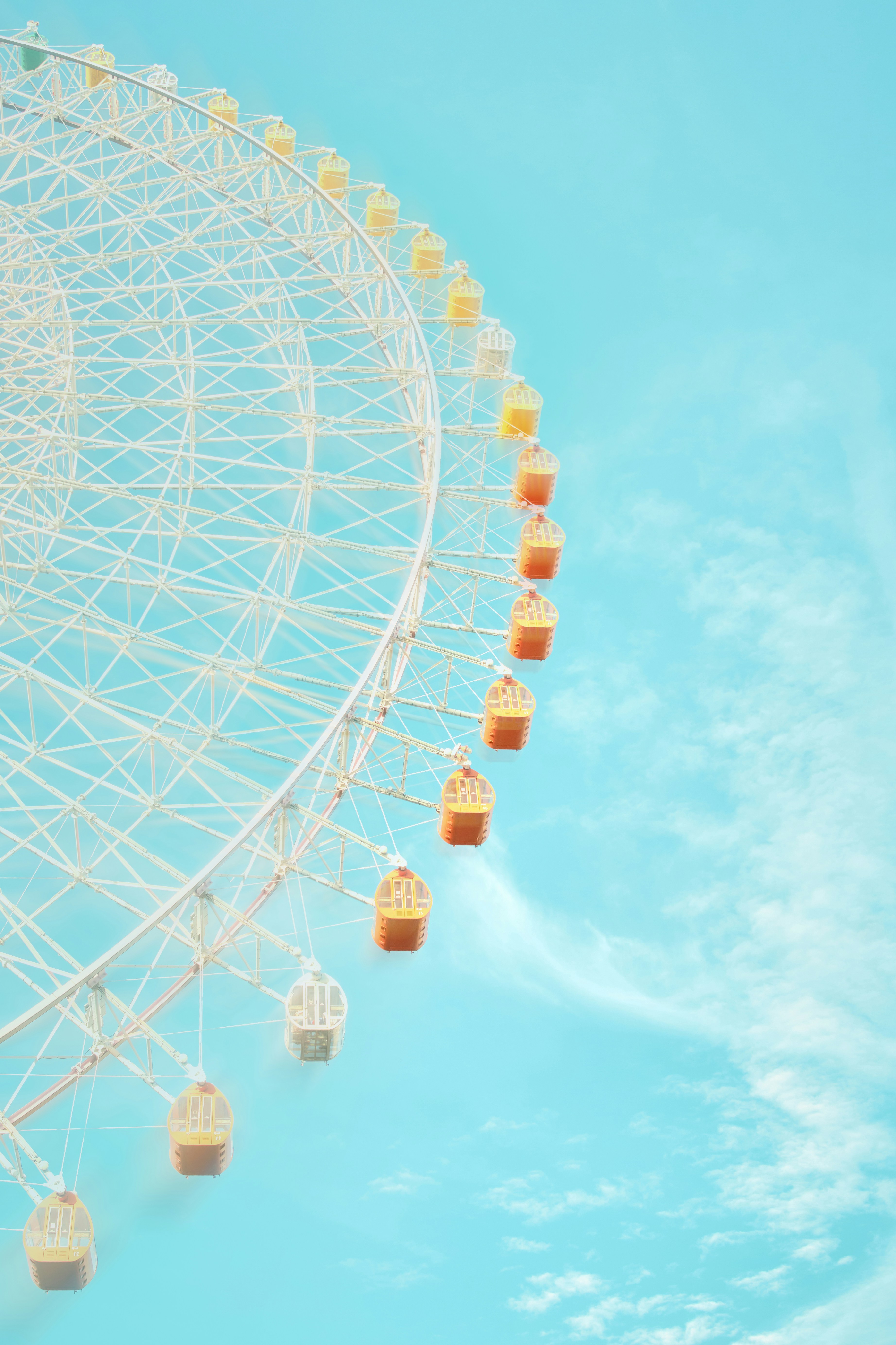 A ferris wheel with many small yellow birds on it photo – Free Osaka ...