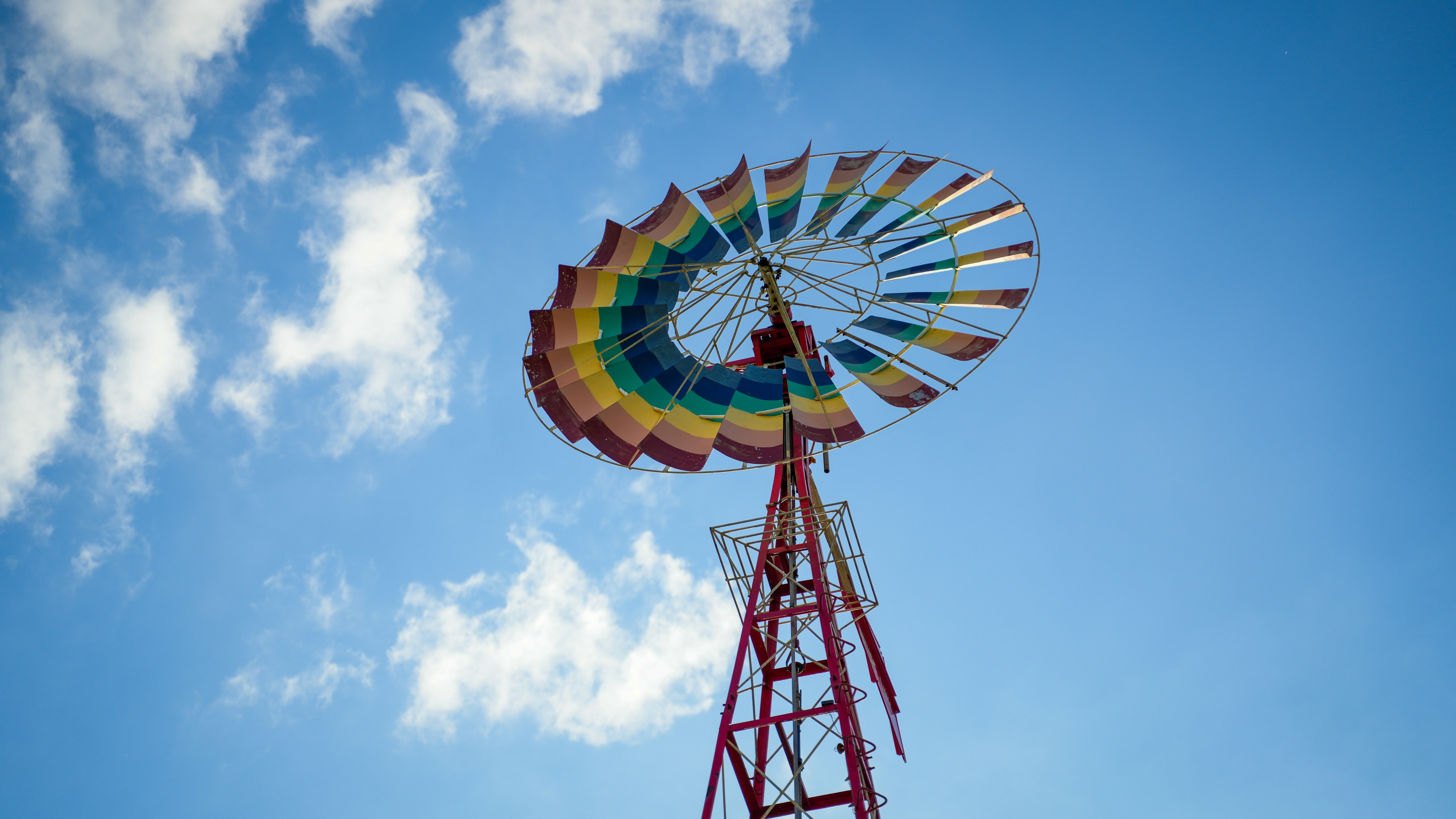 Rainbow Ring on a Crimson Tower under a Clear Blue Sky