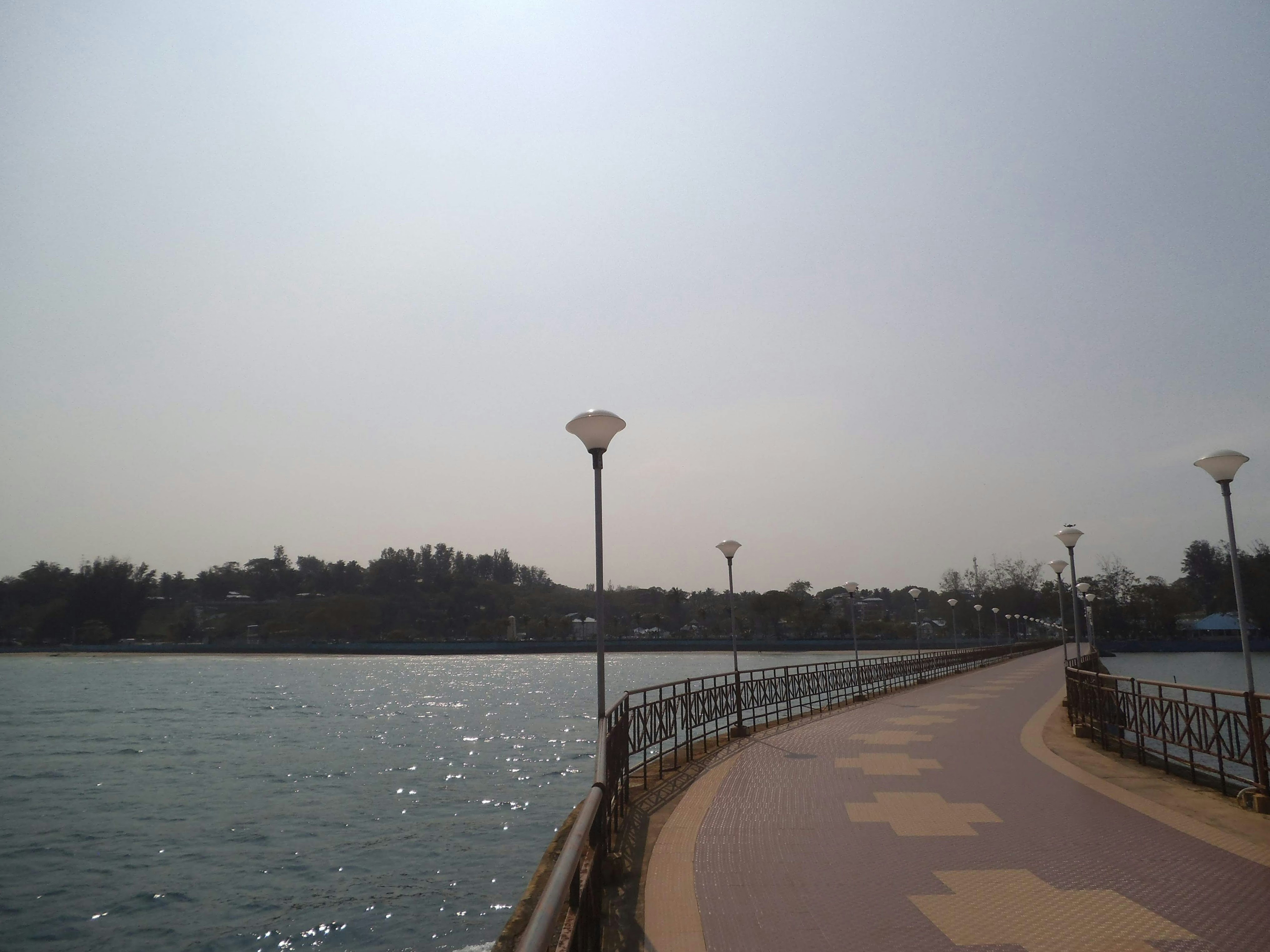 Lantern-Lined Riverside Path Bends Toward a Quiet Horizon