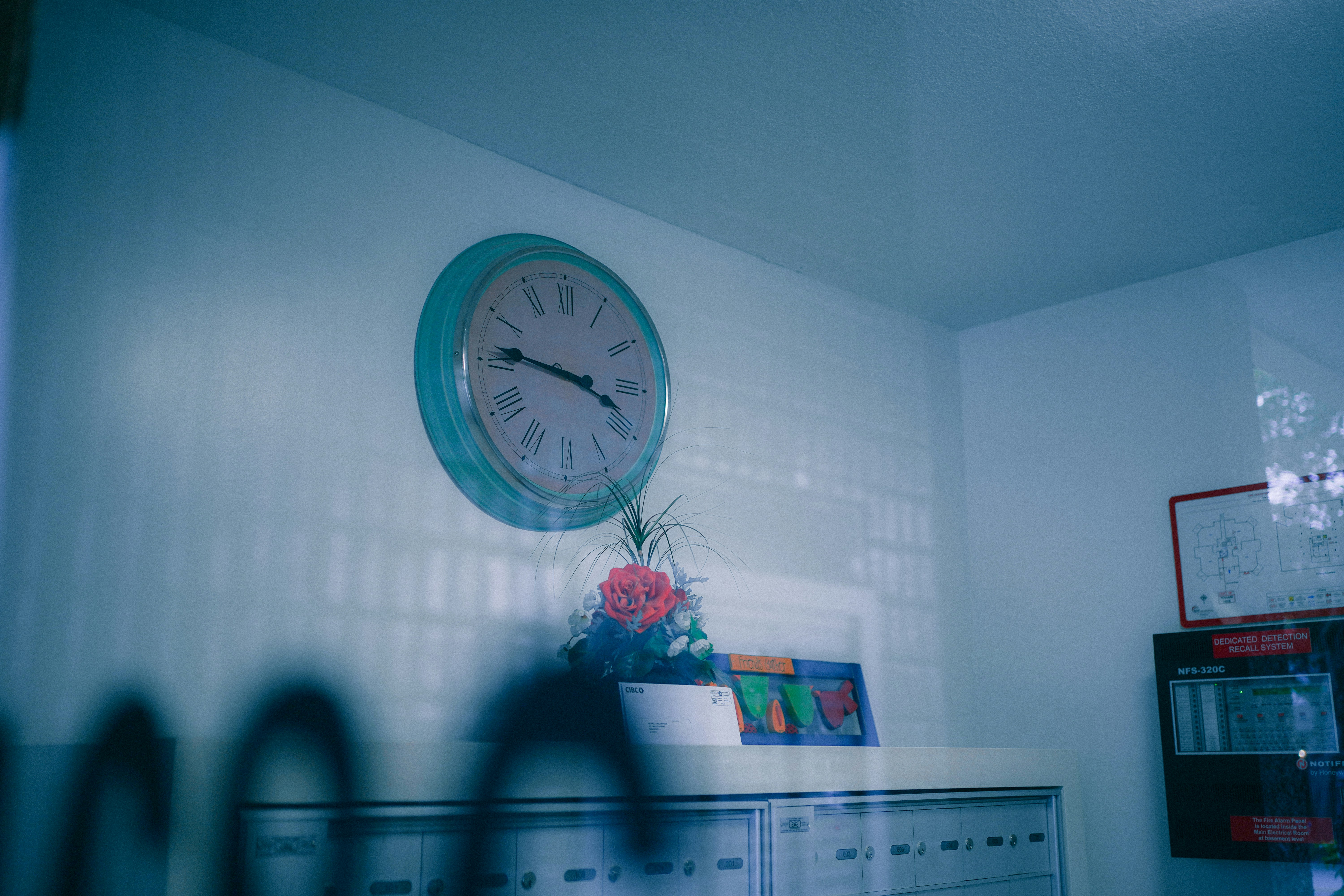 A blurry photo of a room with a clock on the wall photo – Free Analog ...