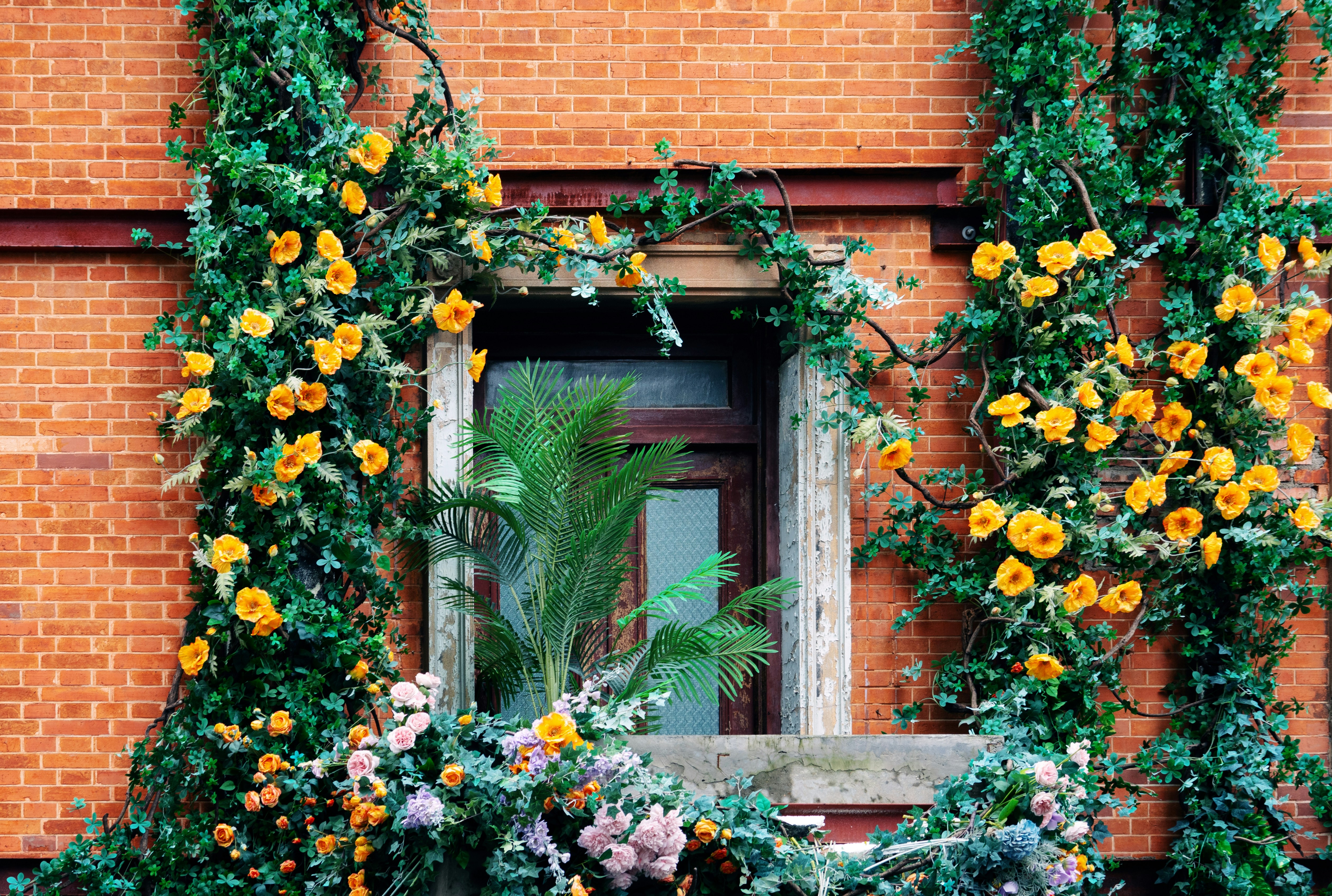 Gate of Golden Vines: Roses Framing a Quiet Brick Entrance