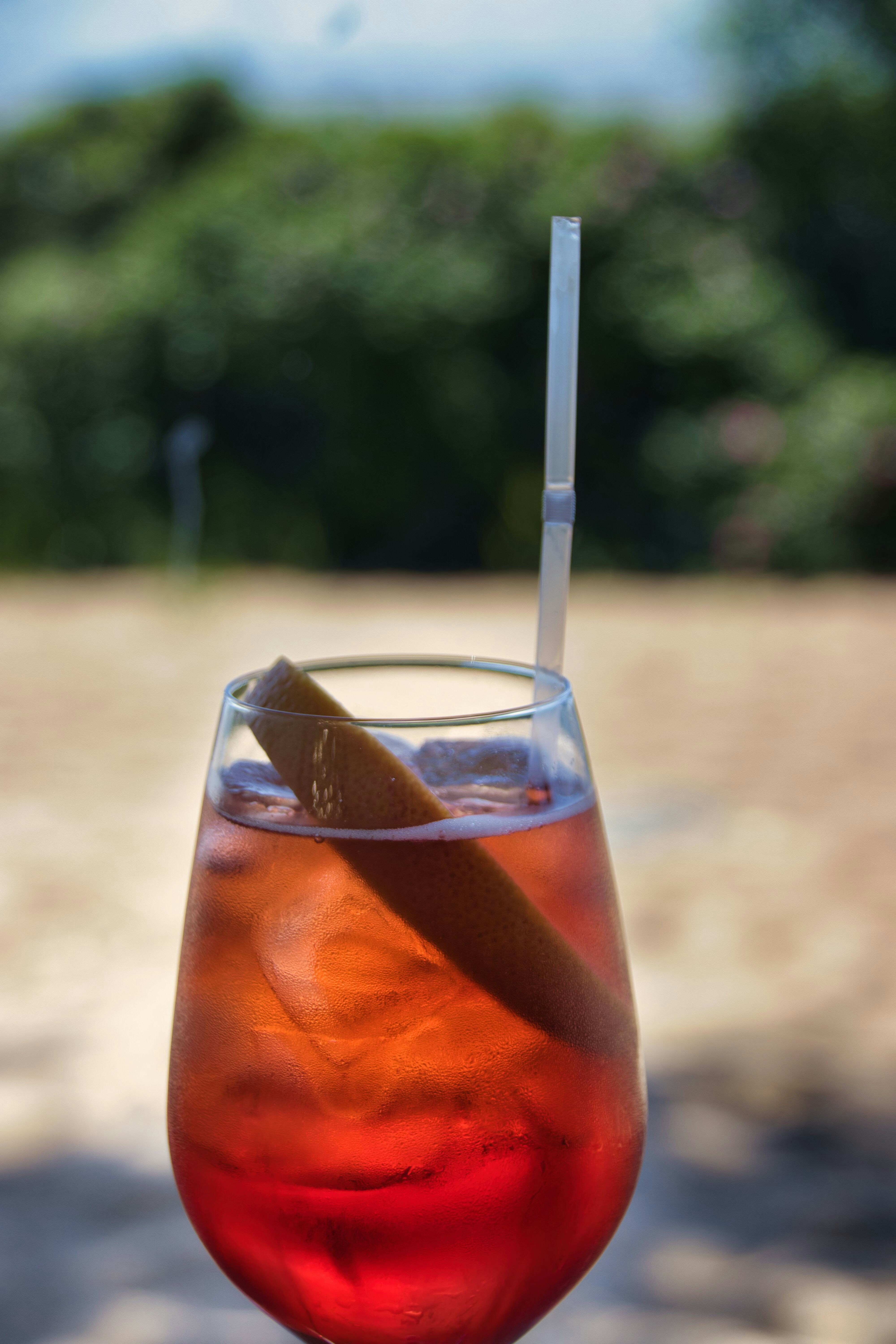 Crimson by the Seashore: A Sunlit Glass with Lime and Straw
