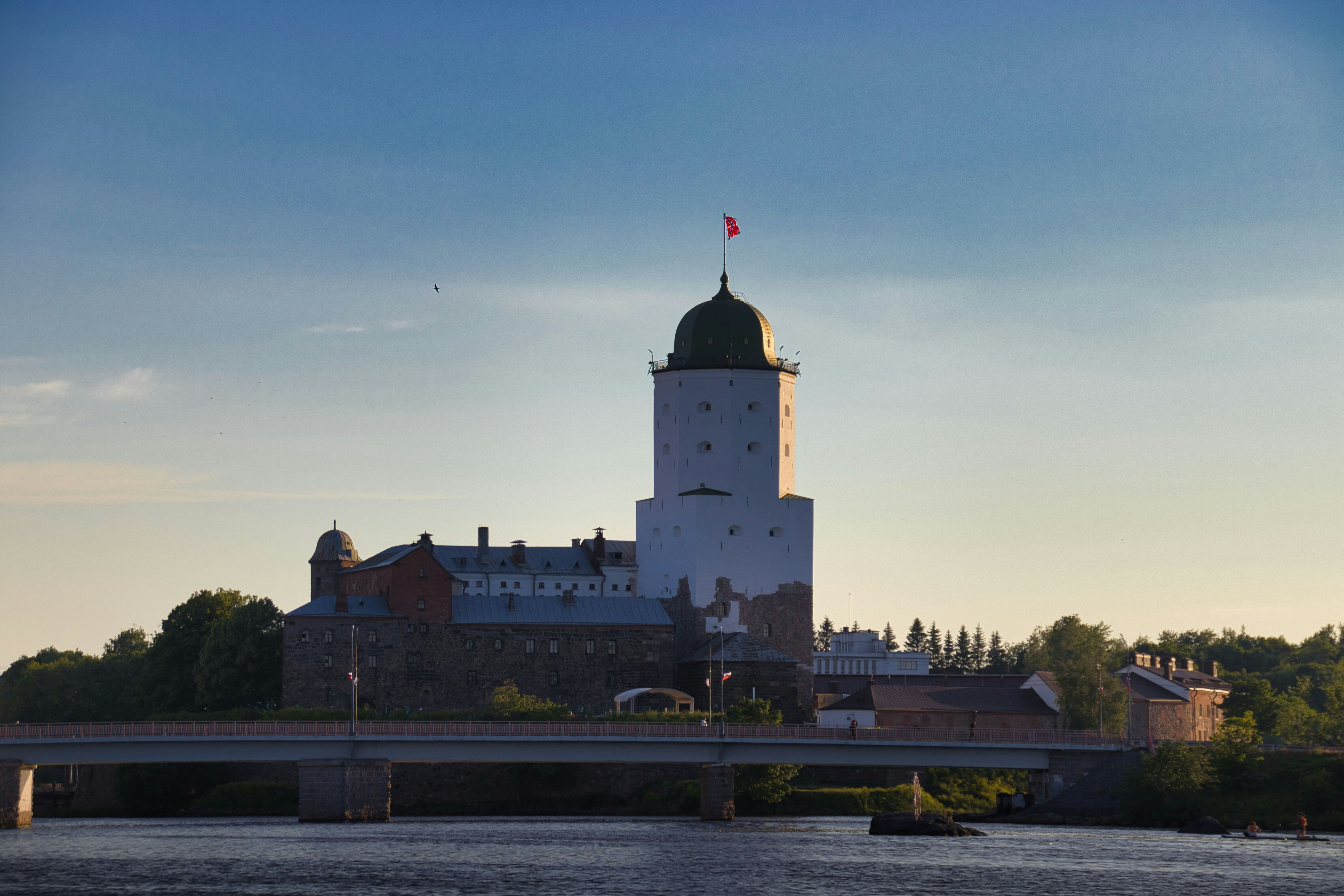 White-Towered Fortress at Dusk Over the Quiet River