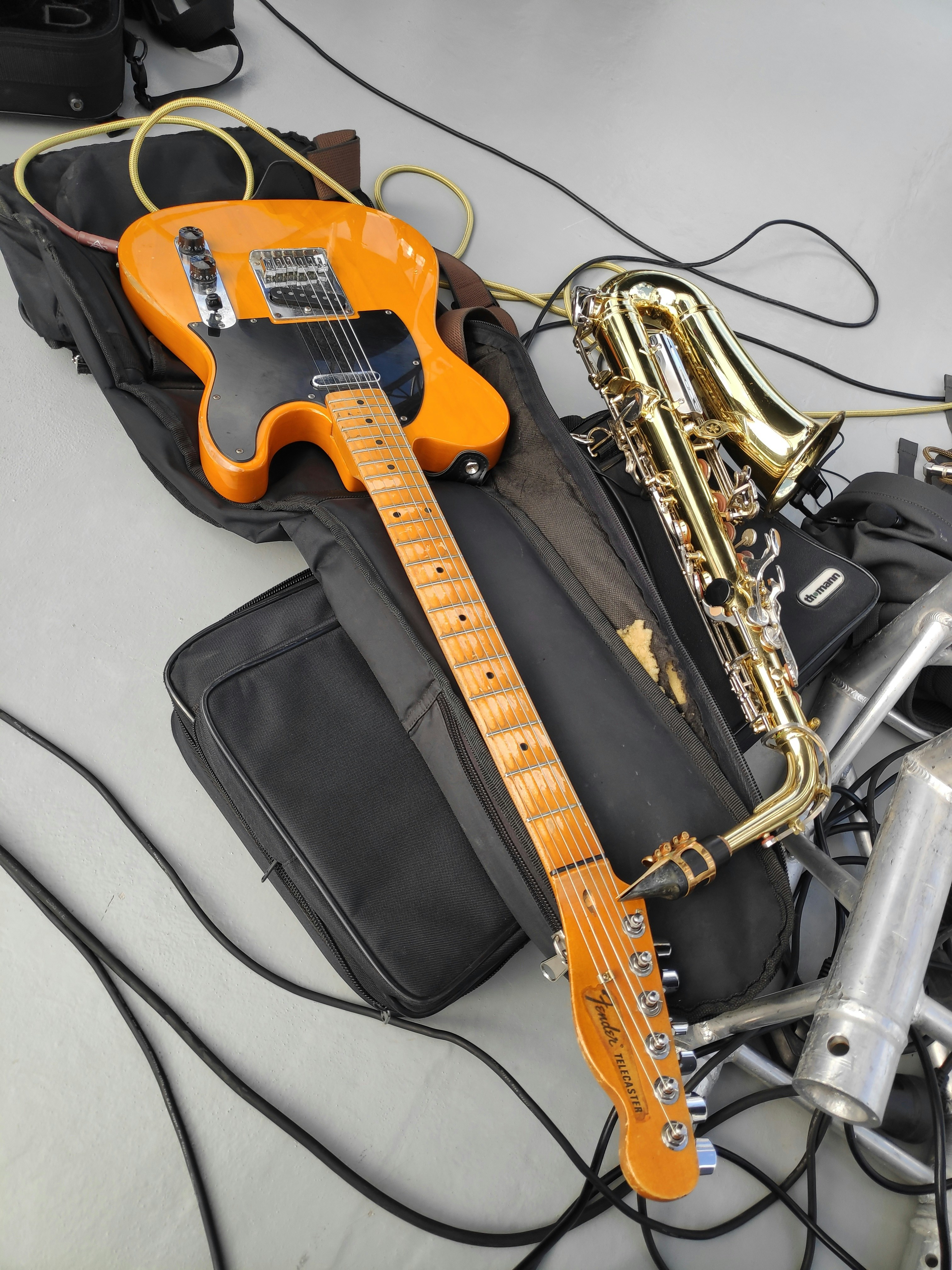 A guitar and other musical instruments are on a table photo – Free ...