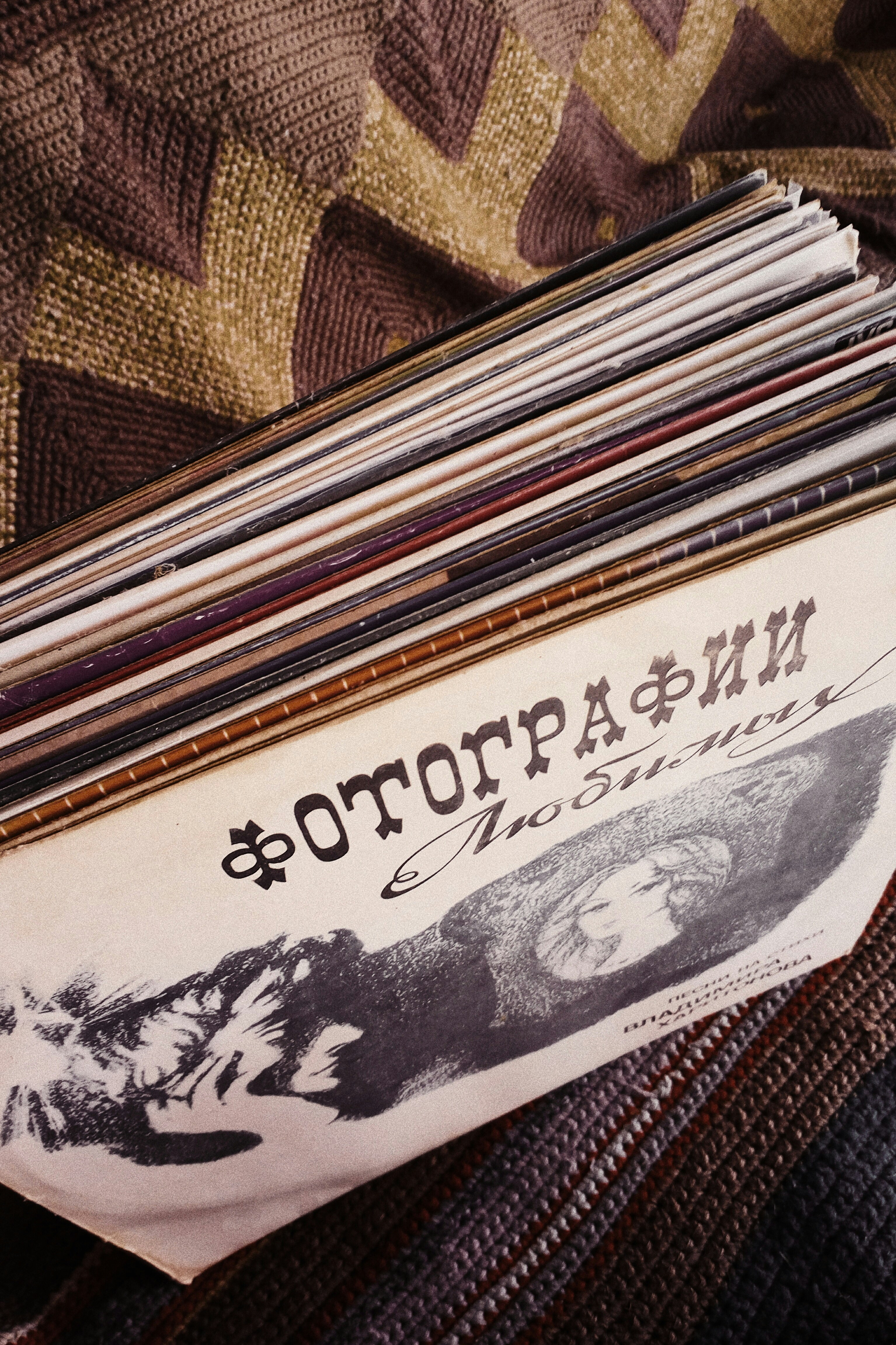 A stack of records sitting on top of a bed photo – Free Music Image on ...