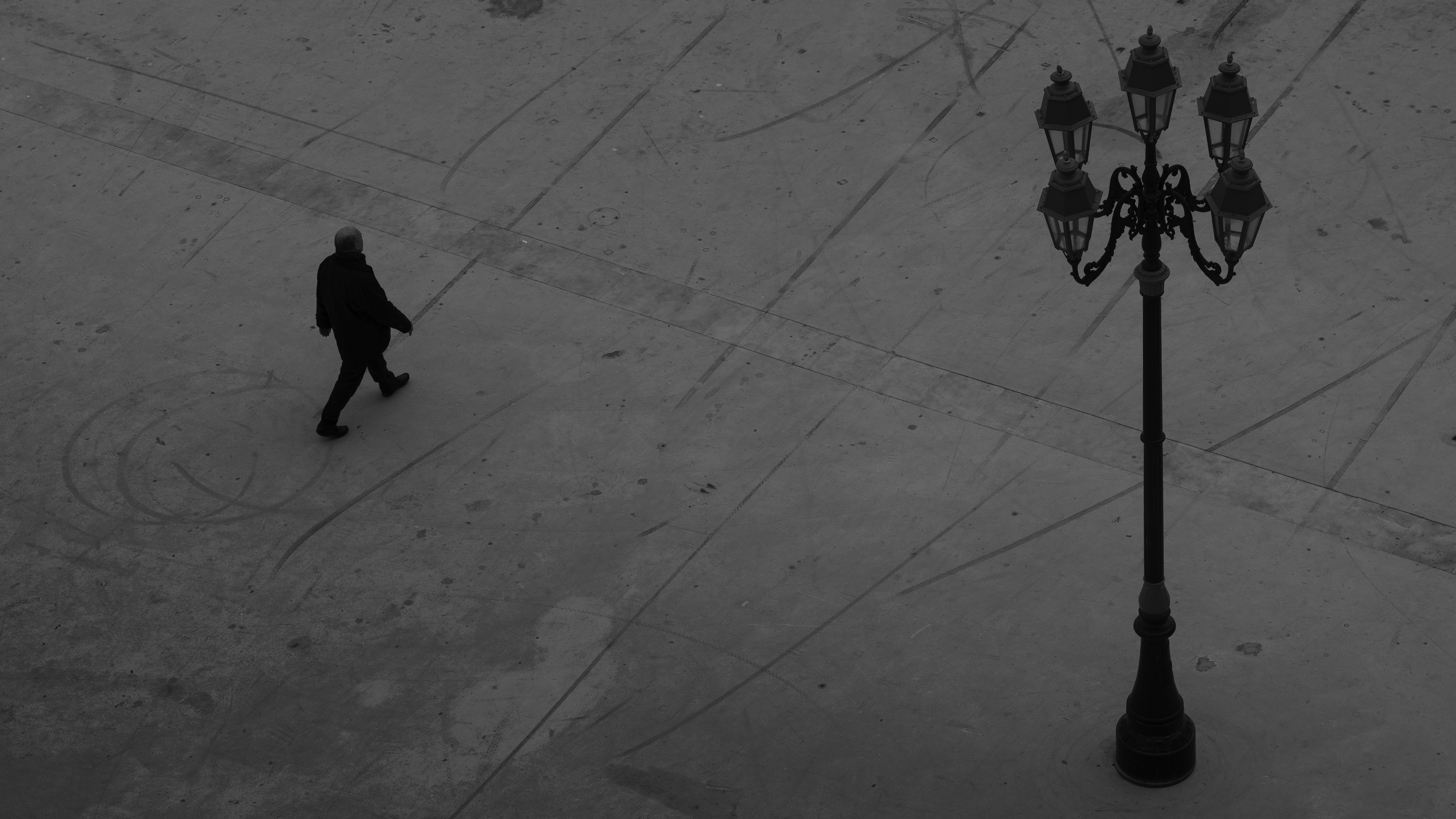 A black and white photo of a person walking in the snow photo – Free ...