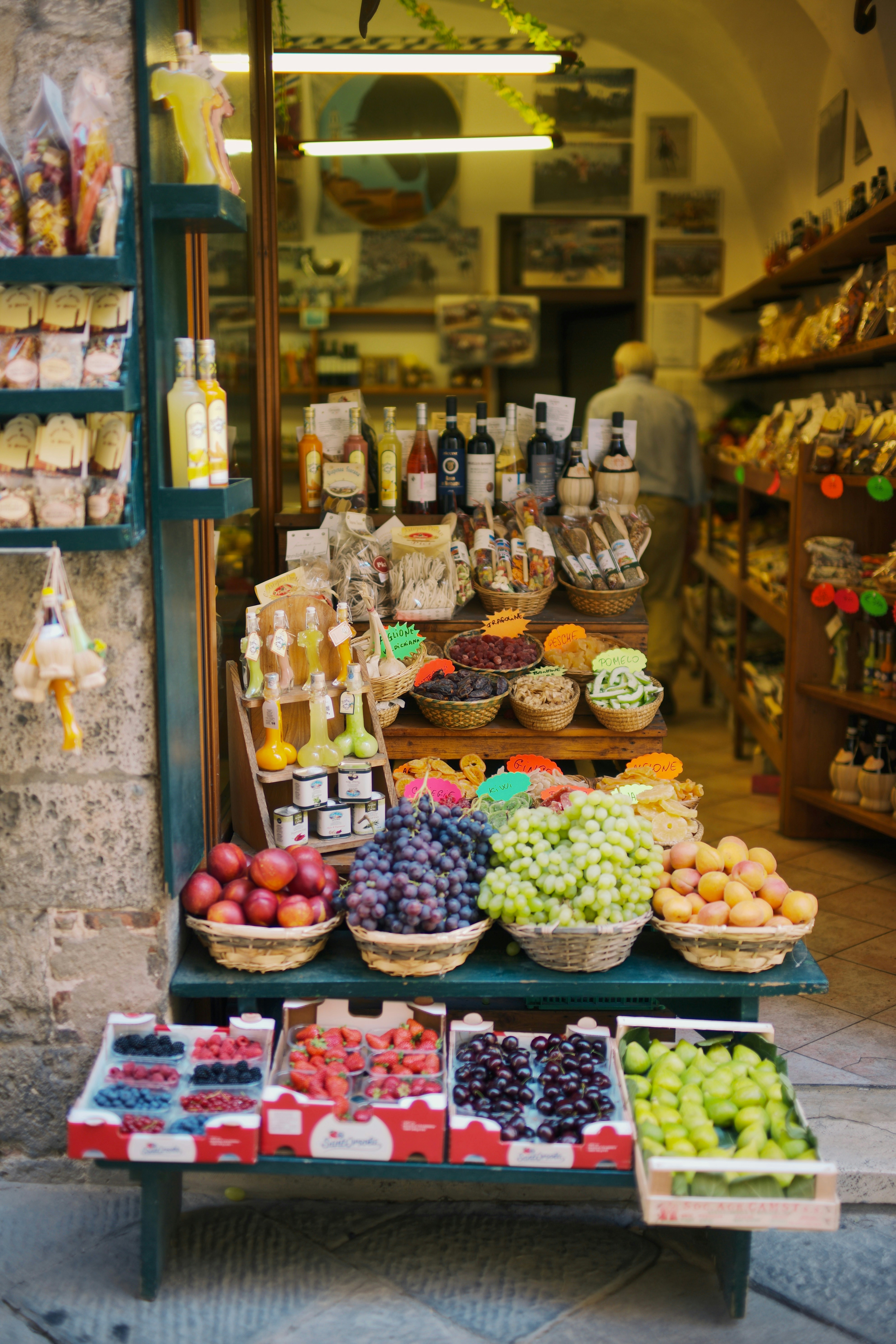 Market Stall Symphony: Colorful Fruits Framing a Cozy Shop Interior