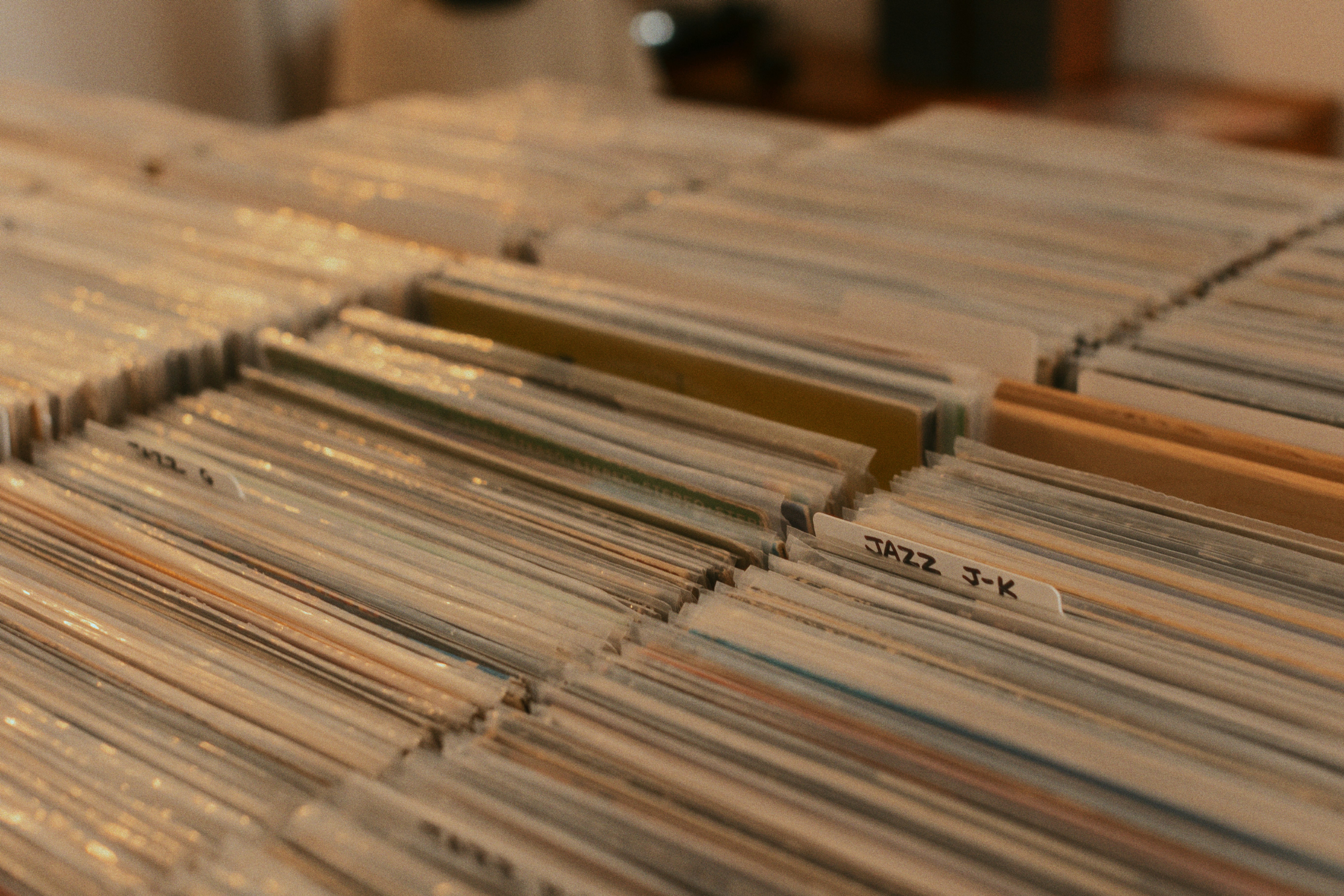 A stack of records sitting on top of a table photo – Free Text Image on ...