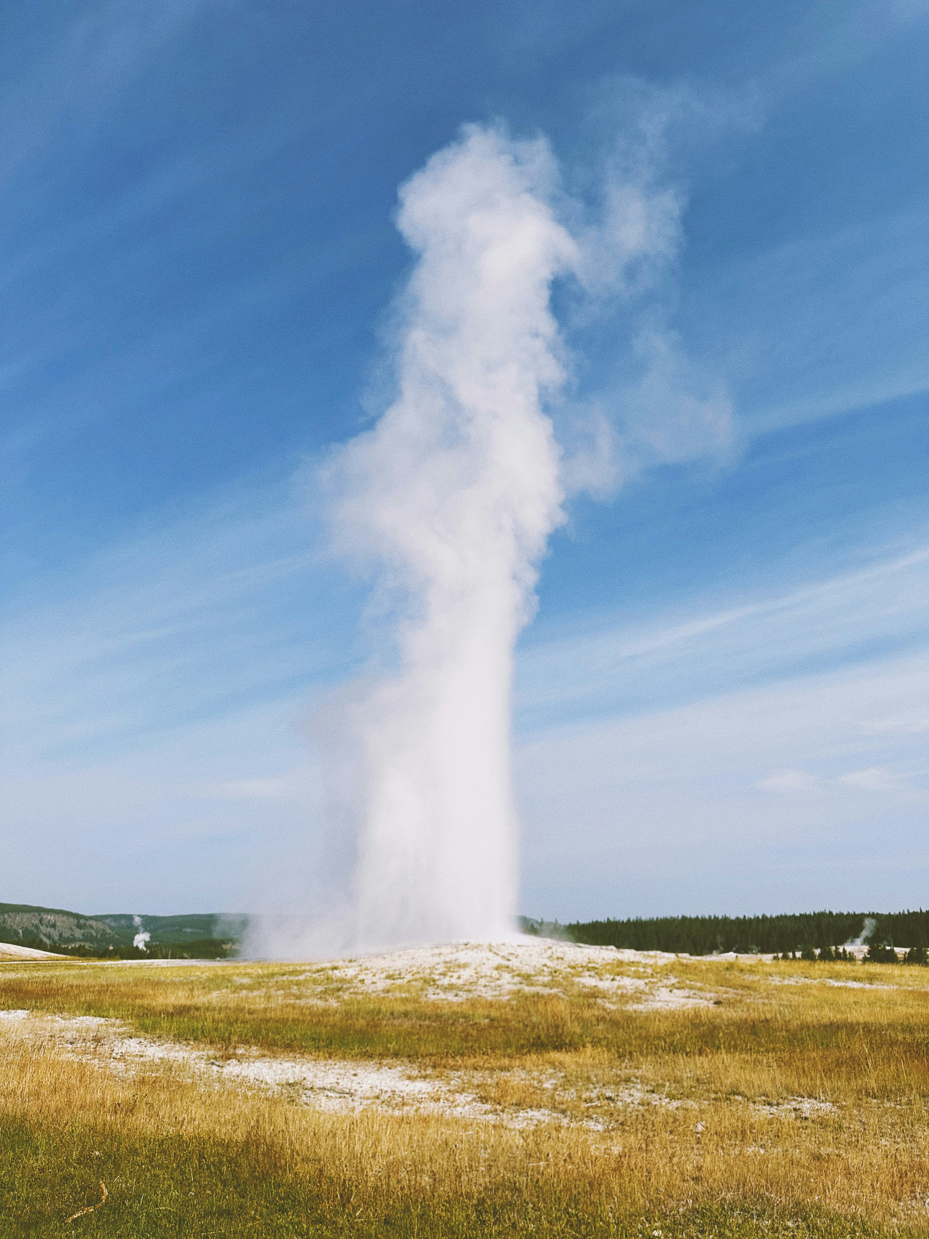 A large geyser spewing water into the sky photo – Free Yellowstone ...