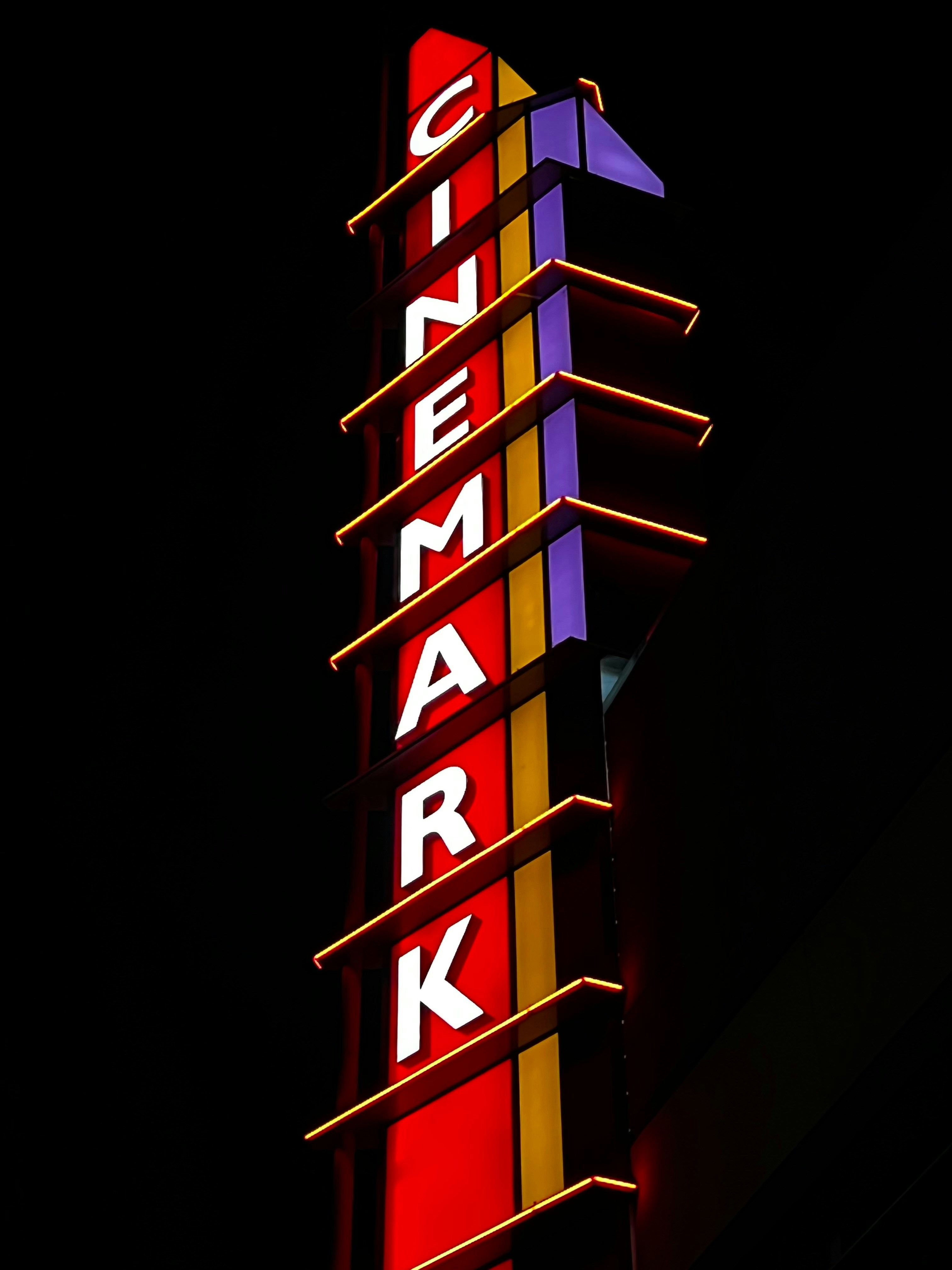 Vertical Neon Beacon: Cinemark Sign Piercing Night