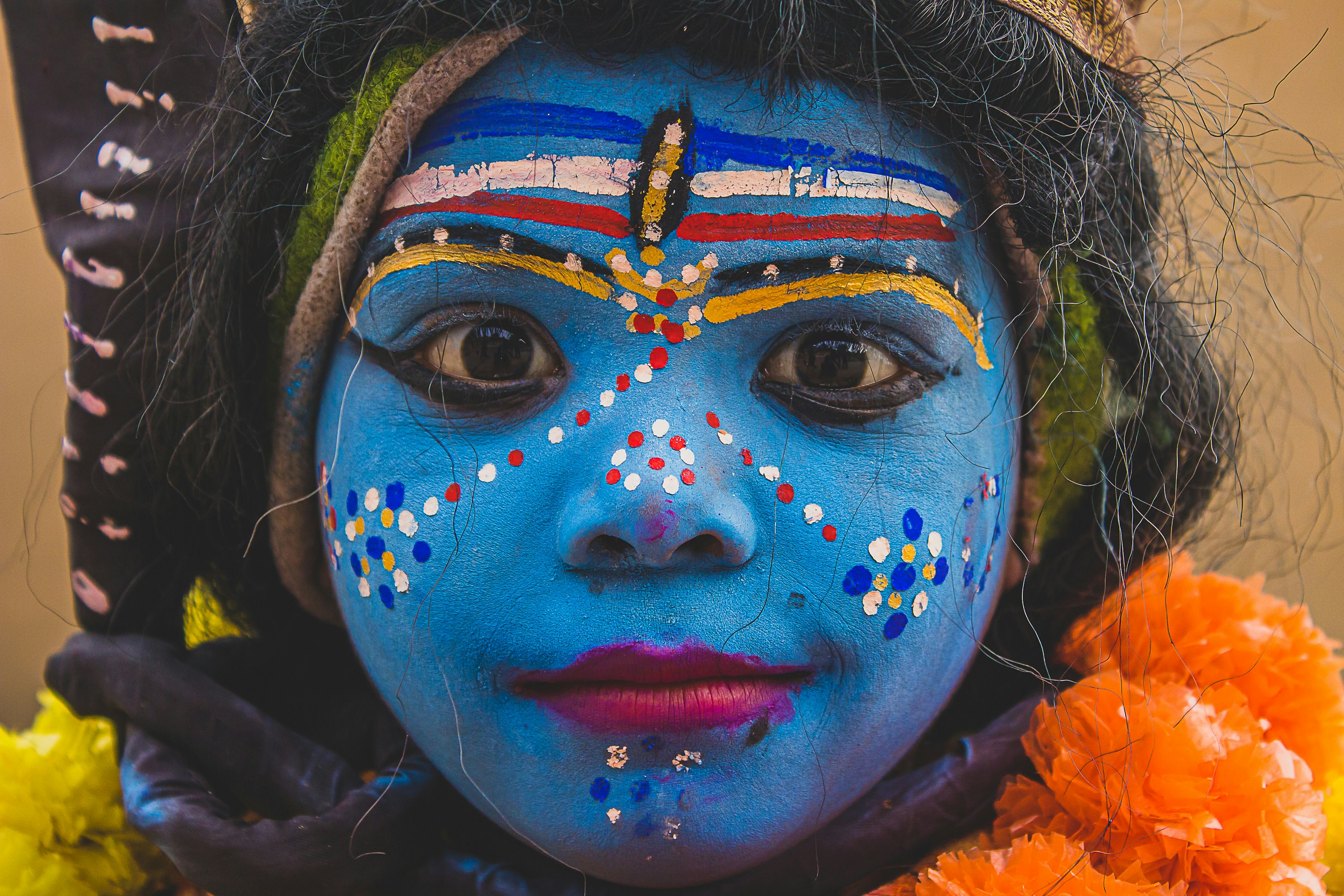 A person with blue paint on their face photo – Free Portrait Image on ...