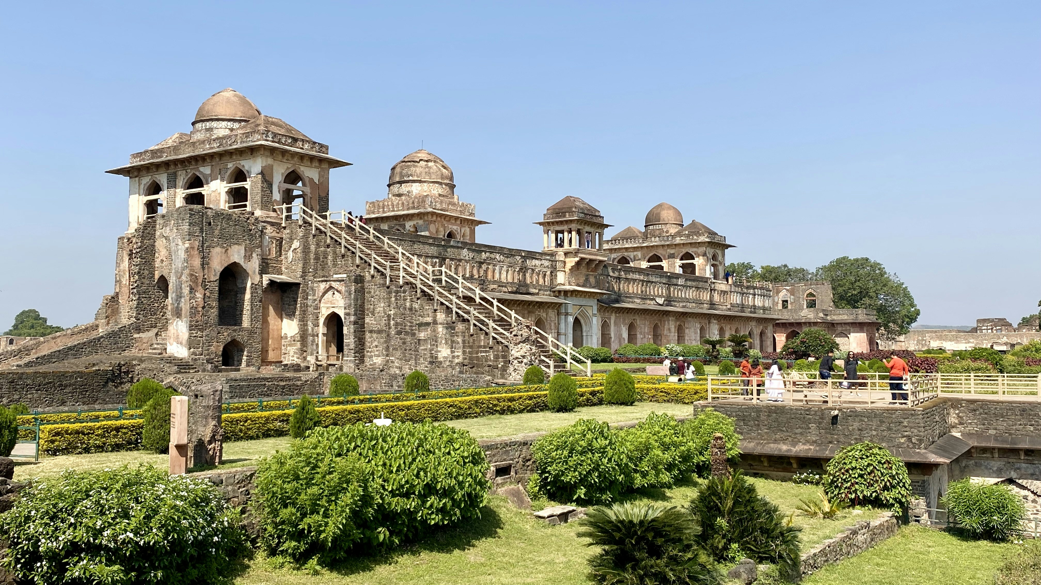 A large building with a lot of trees in front of it