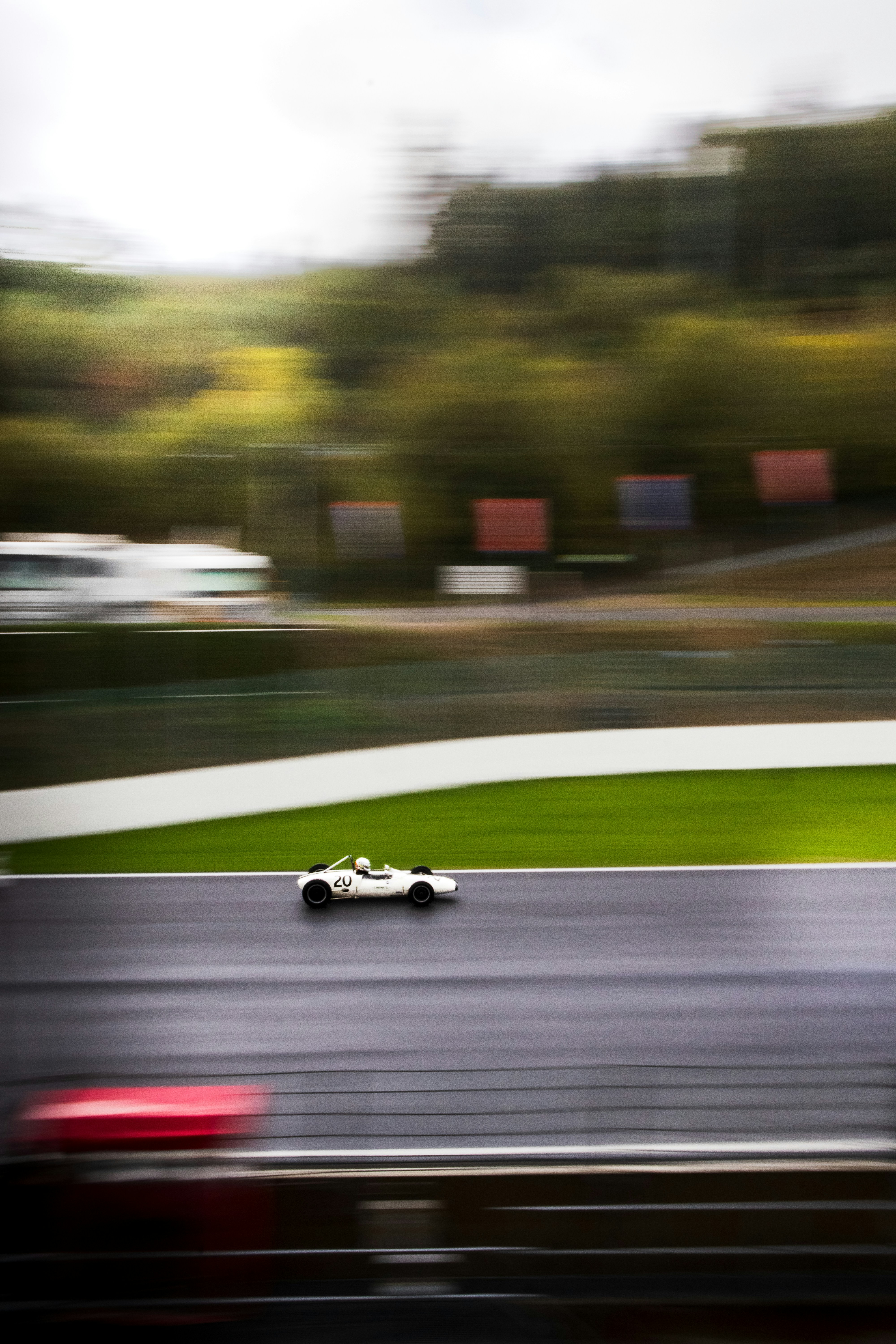 A blurry photo of a race car on a track photo – Free Background Image ...