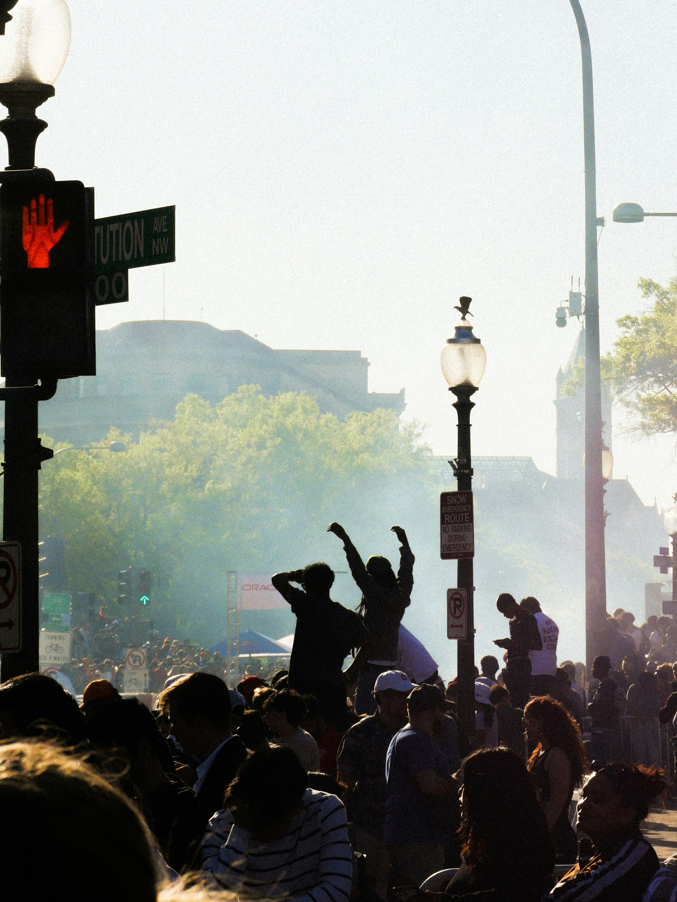 City Crowd Pulse: Silhouettes at a Sunlit Intersection