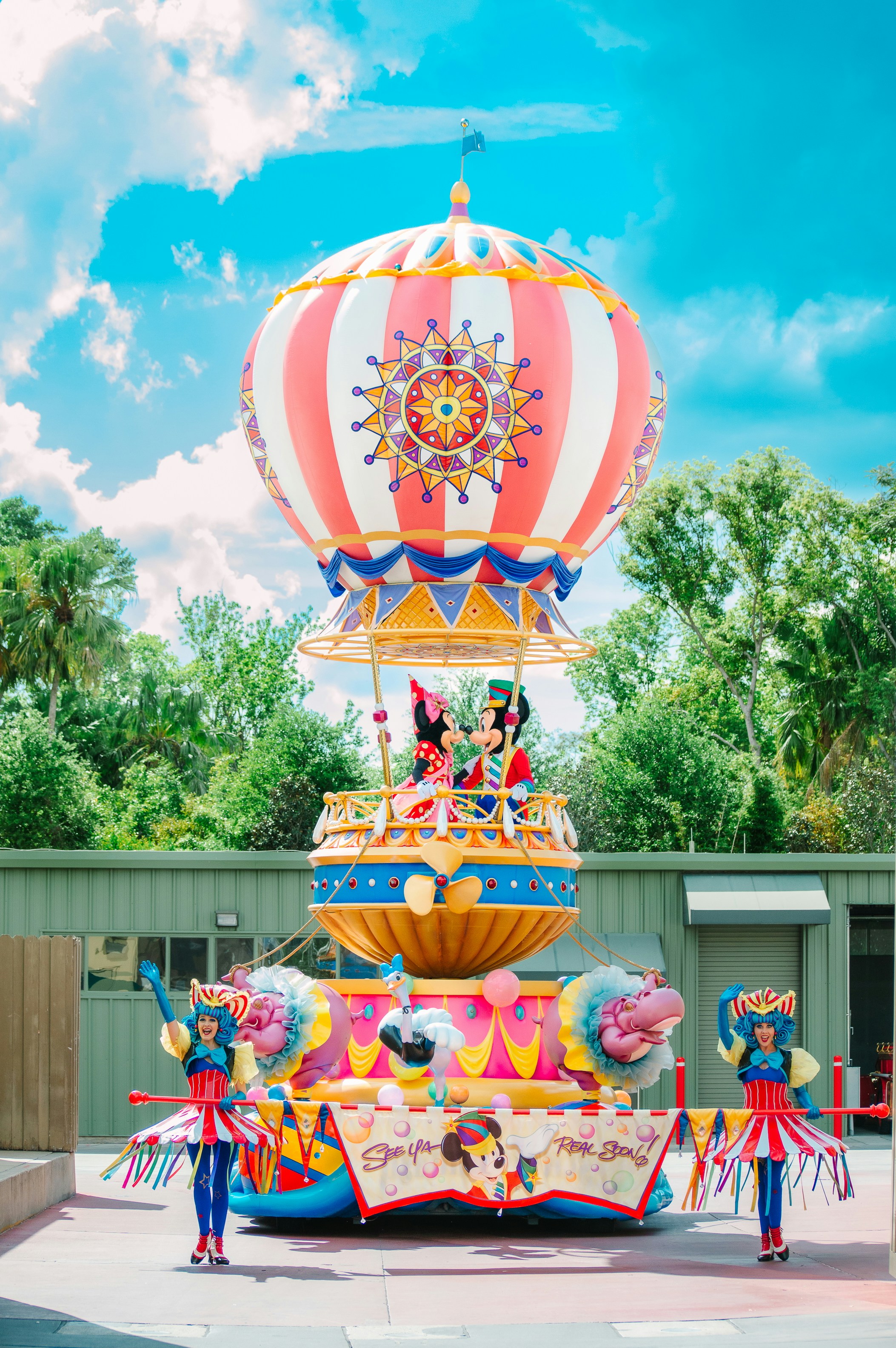 A carnival float with a person standing in front of it photo – Free ...