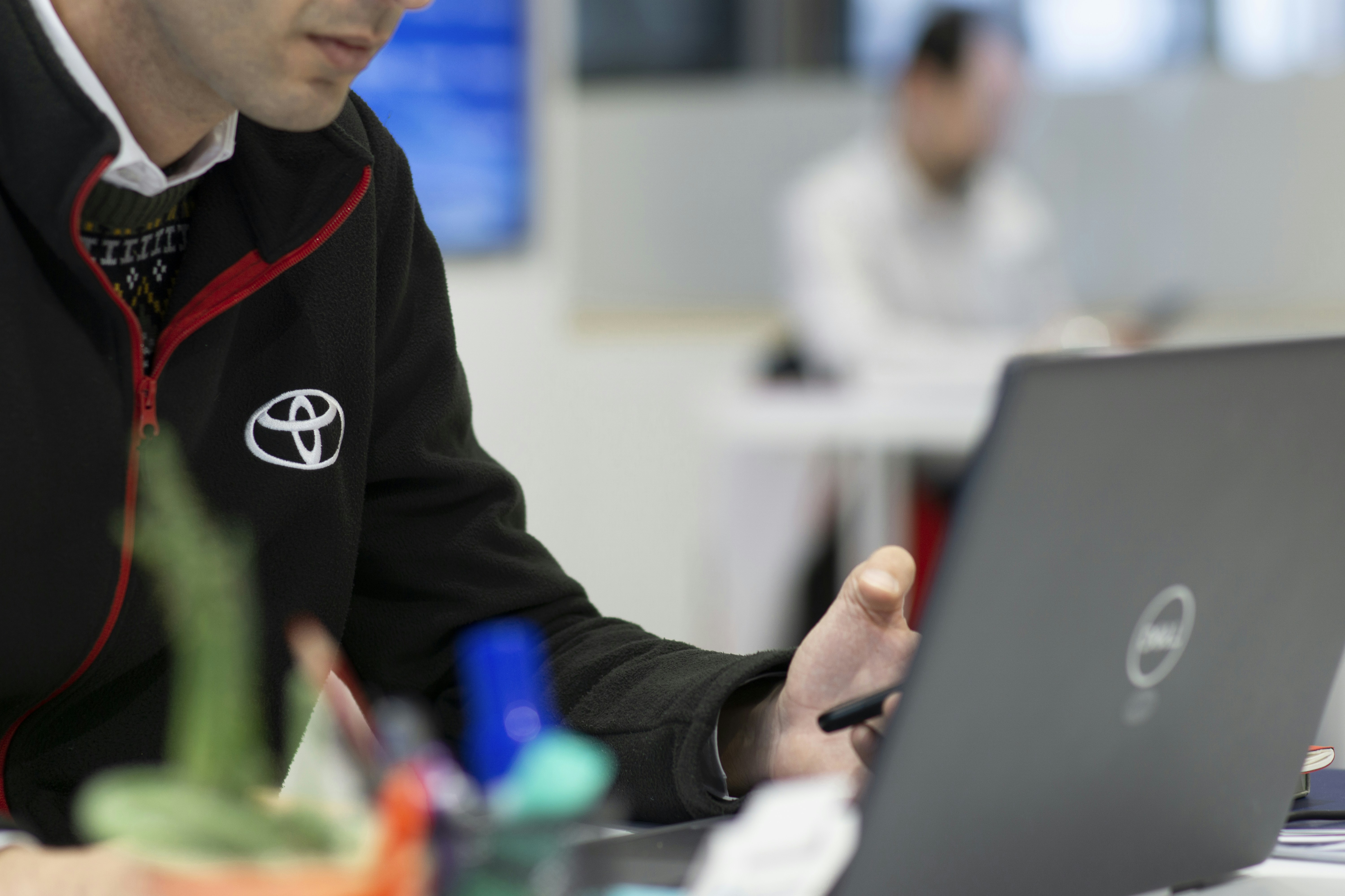A man sitting in front of a laptop computer photo – Free Service Image ...