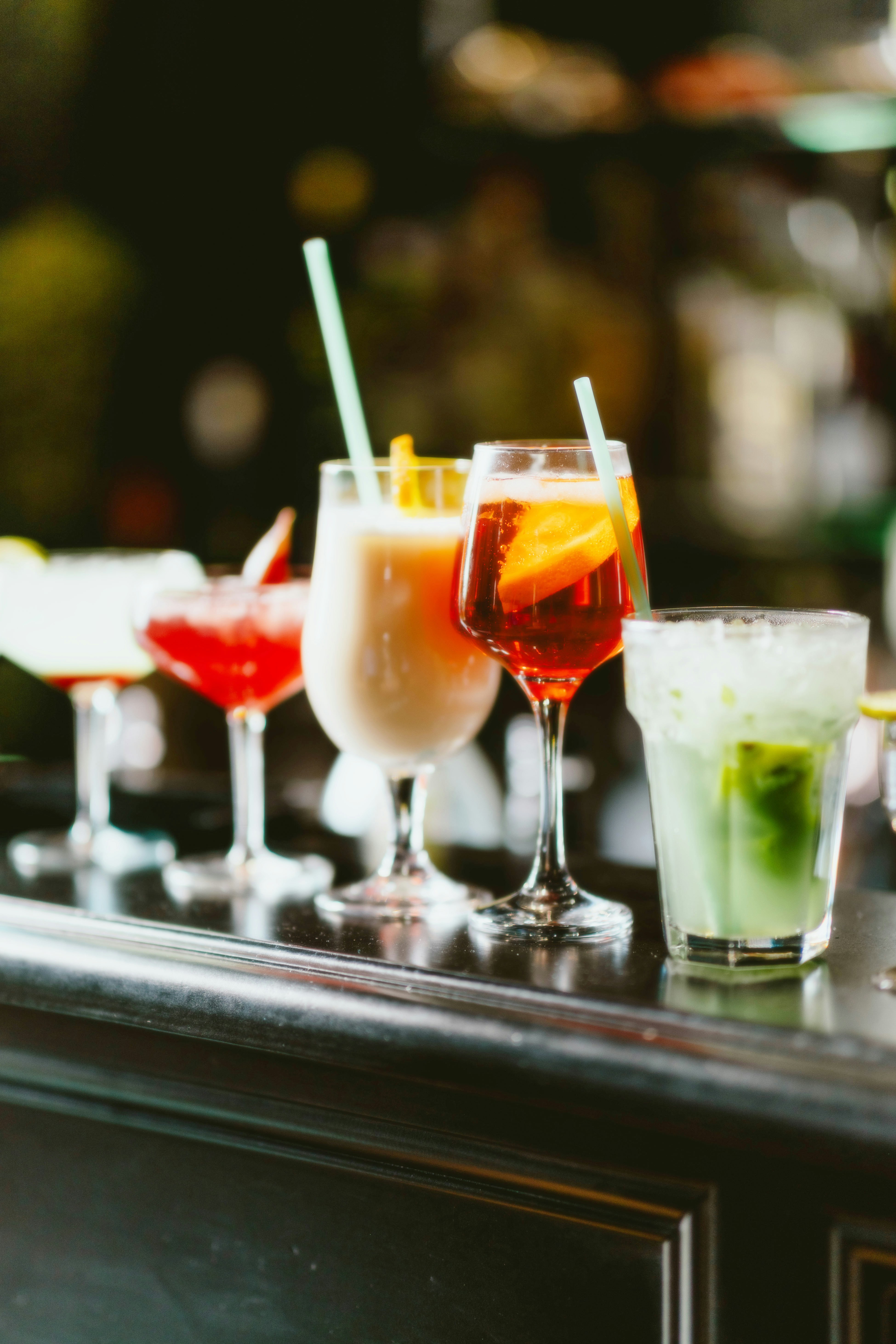 A row of different types of drinks on a bar photo – Free Food and drink ...
