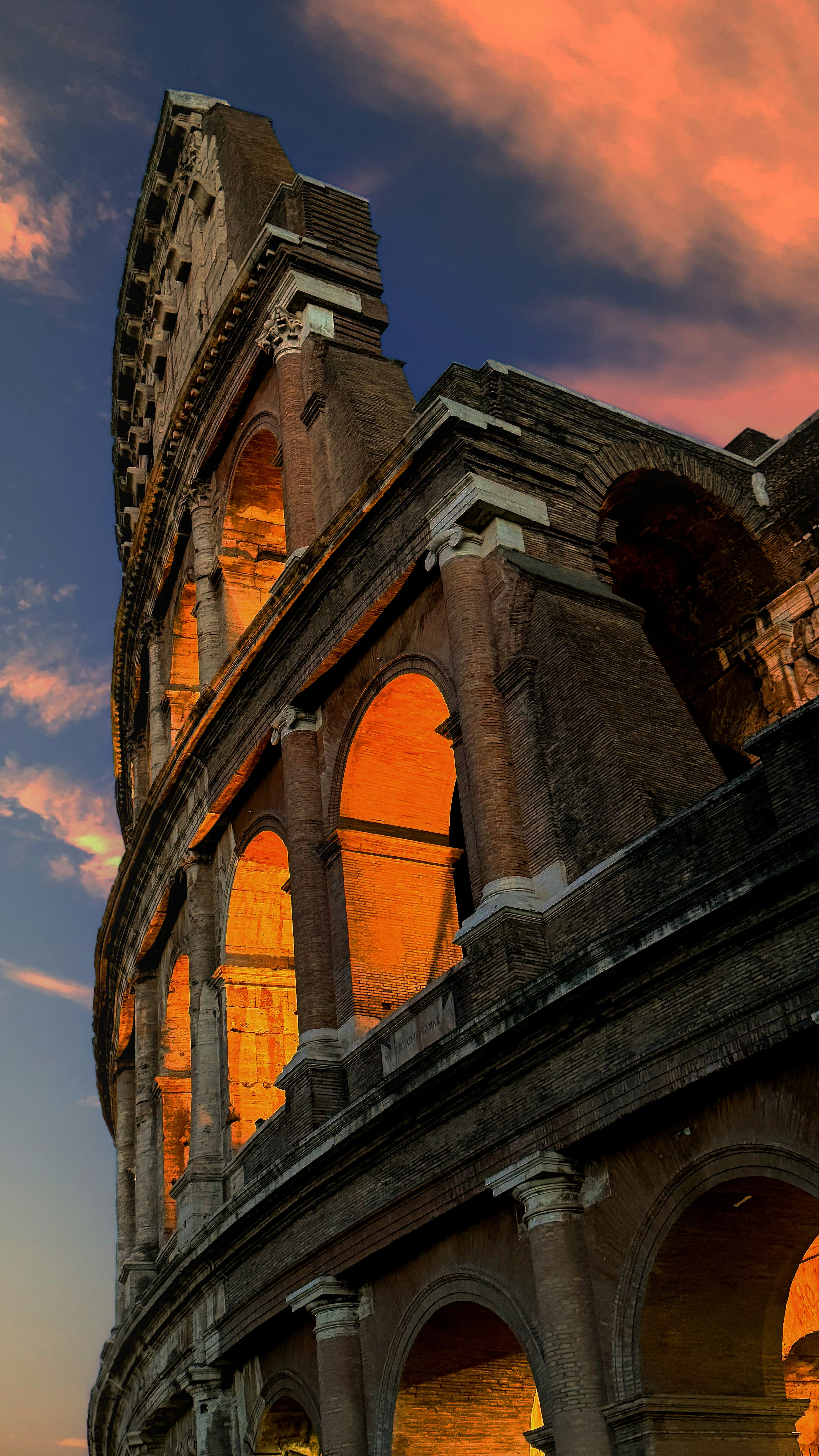 Sunlit Arches: Evening Glow on the Ancient Colosseum