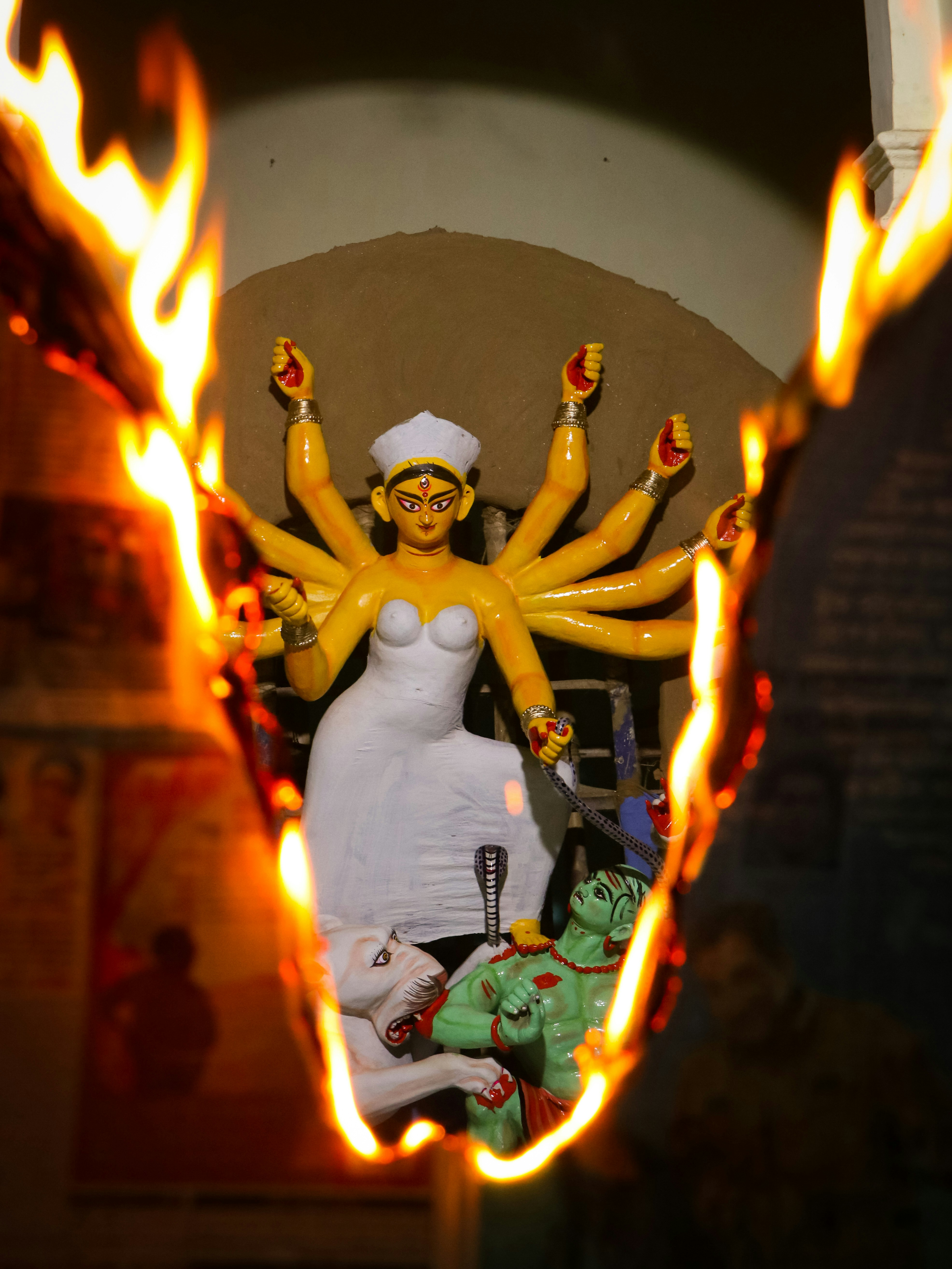 Durga in a Ring of Fire: The Multi-Armed Goddess Surrounded by Ritual Flames