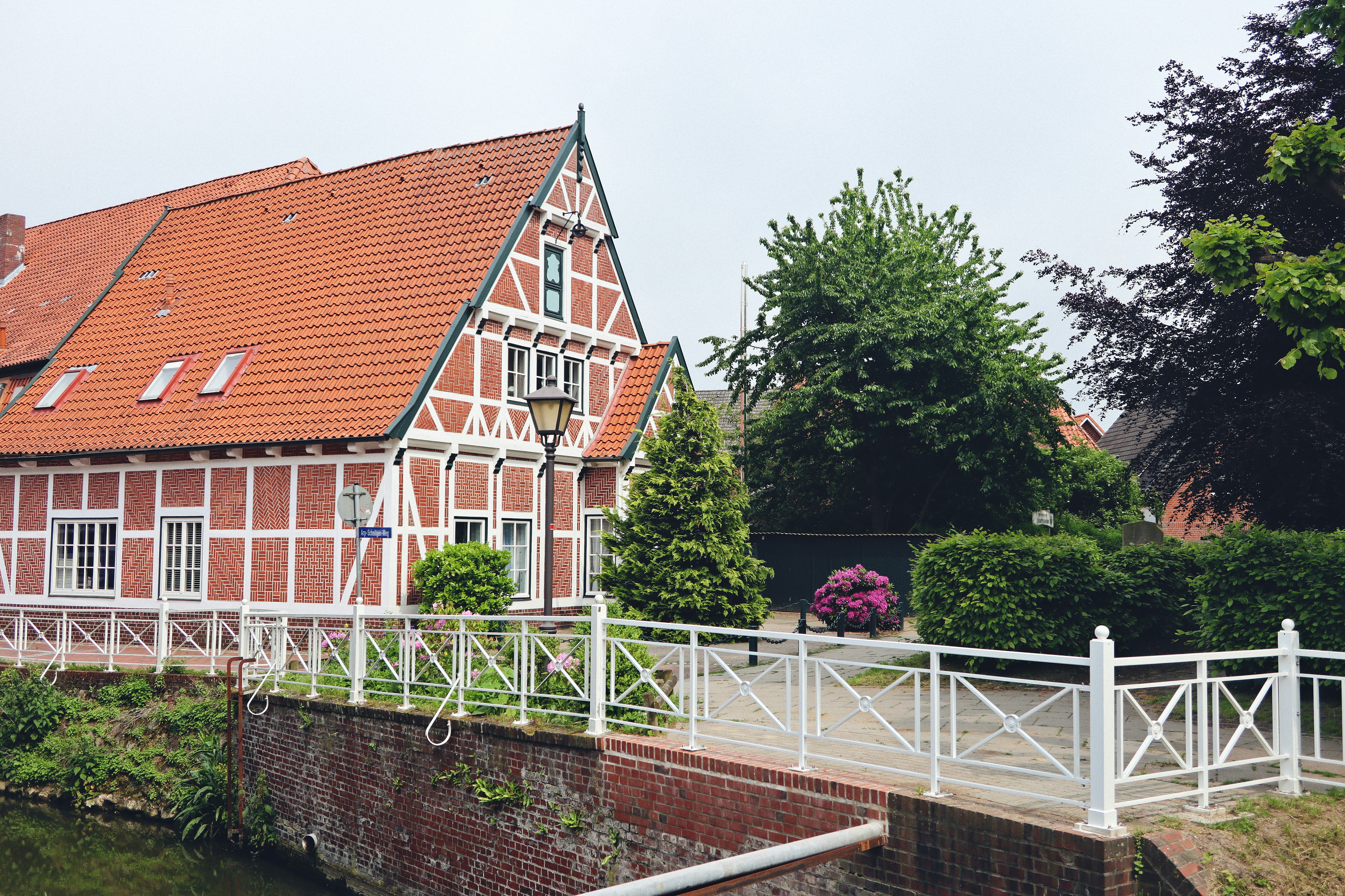 Riverside Timber-Frame by a Quiet Canal