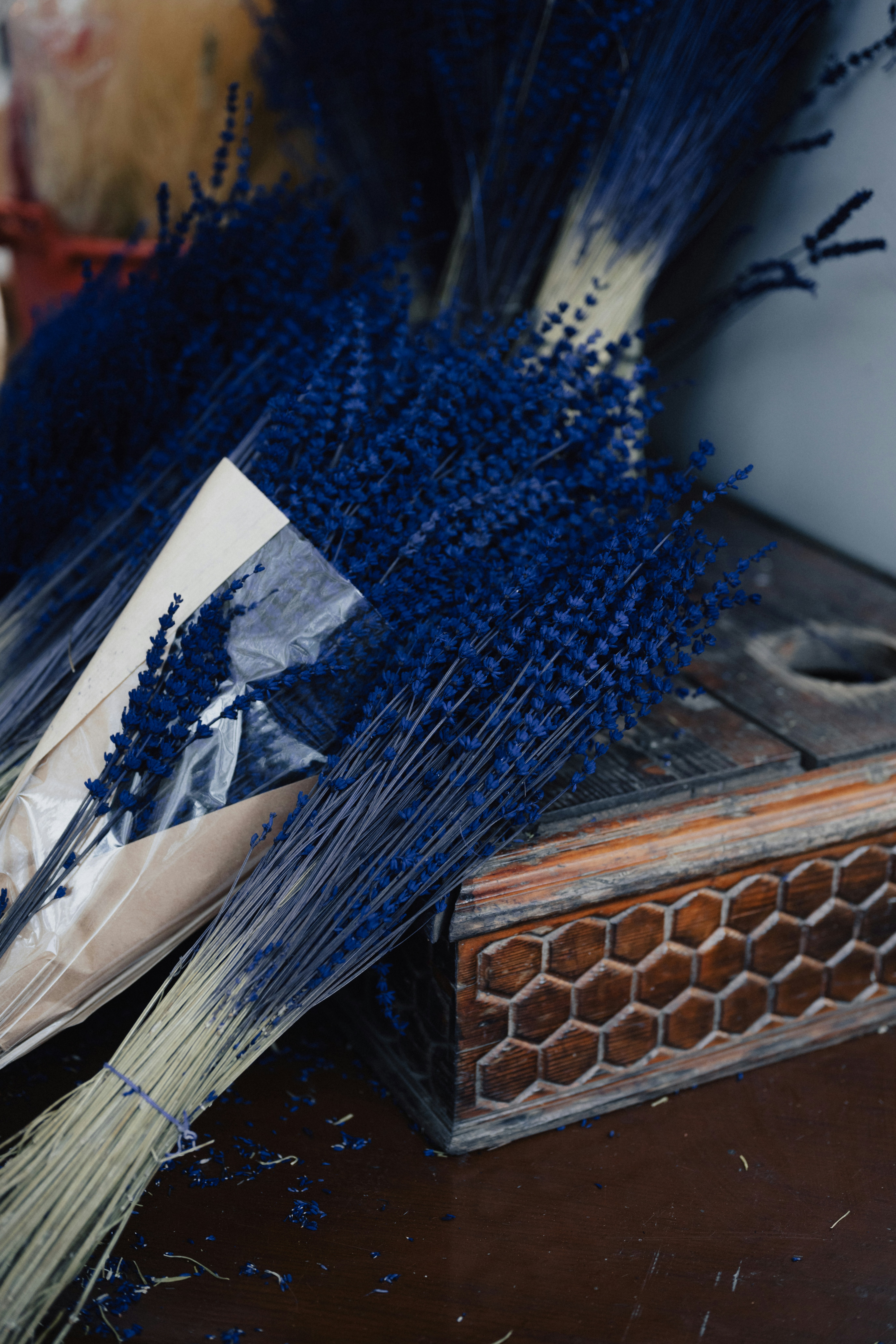 Azure Lavender Bundles Rest Against a Rustic Honeycomb Box