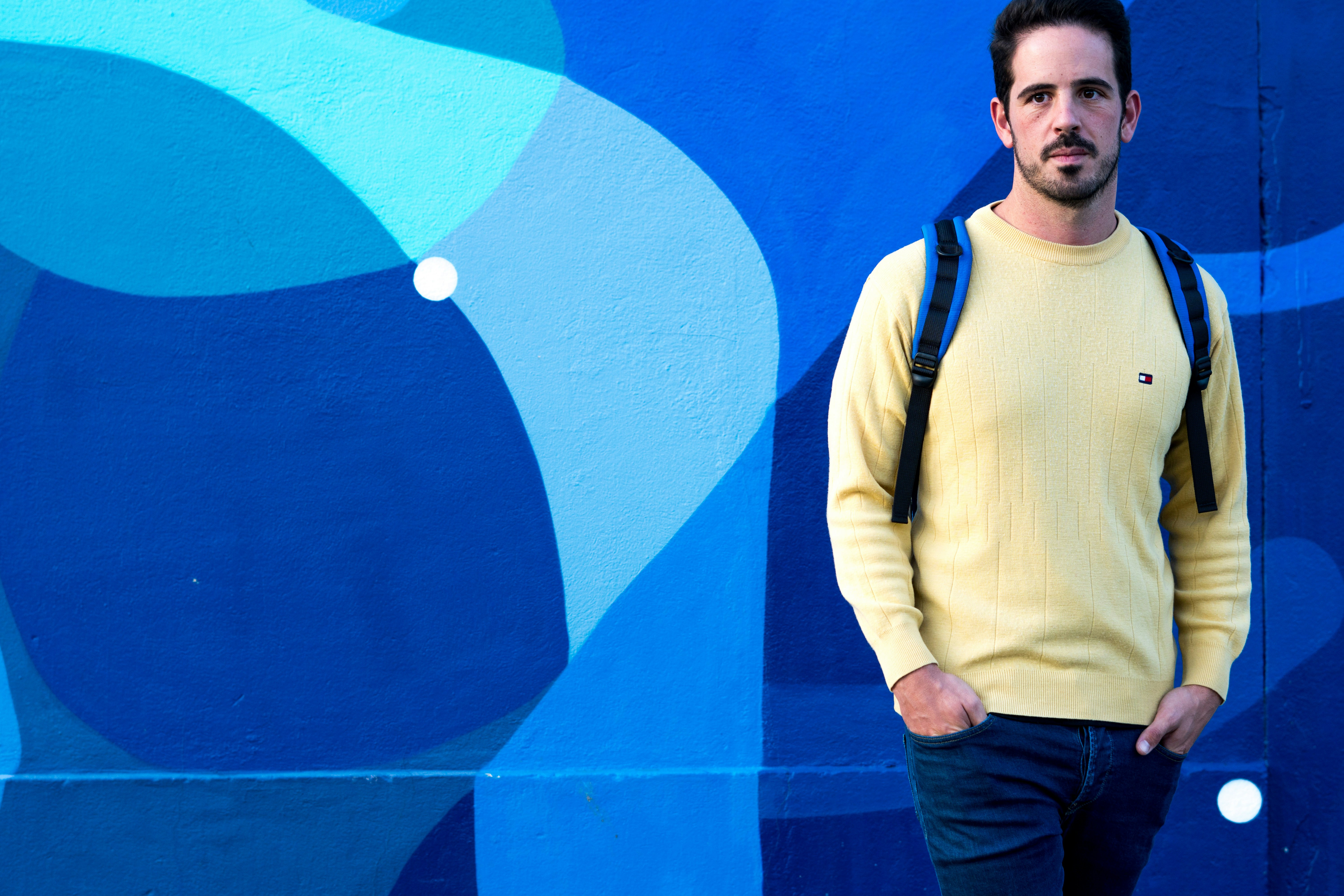 Yellow on Blue: Portrait Against an Urban Graffiti Vista