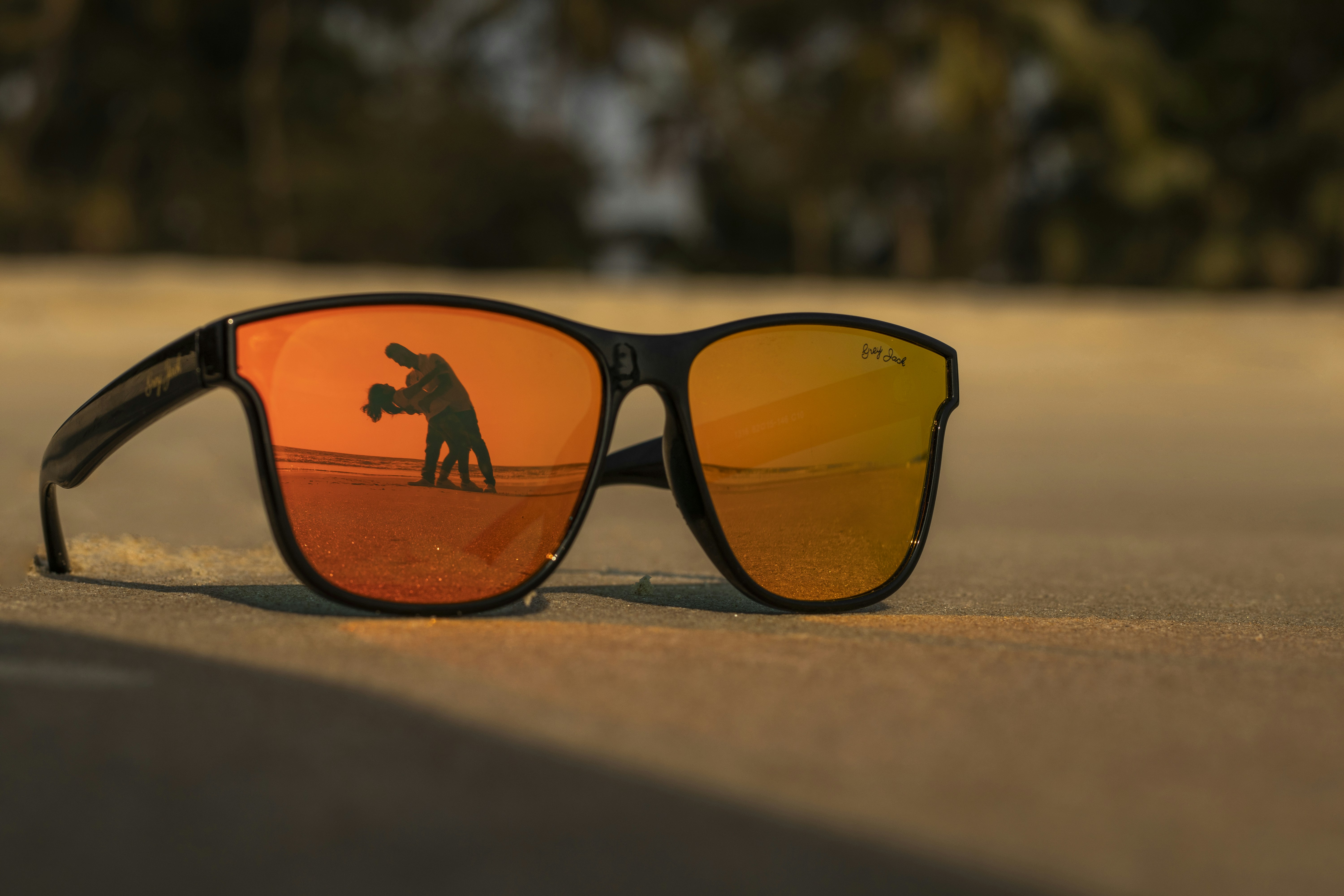 Amber Lenses, Quiet Scene: A Figure and Dog Reflected on Sand