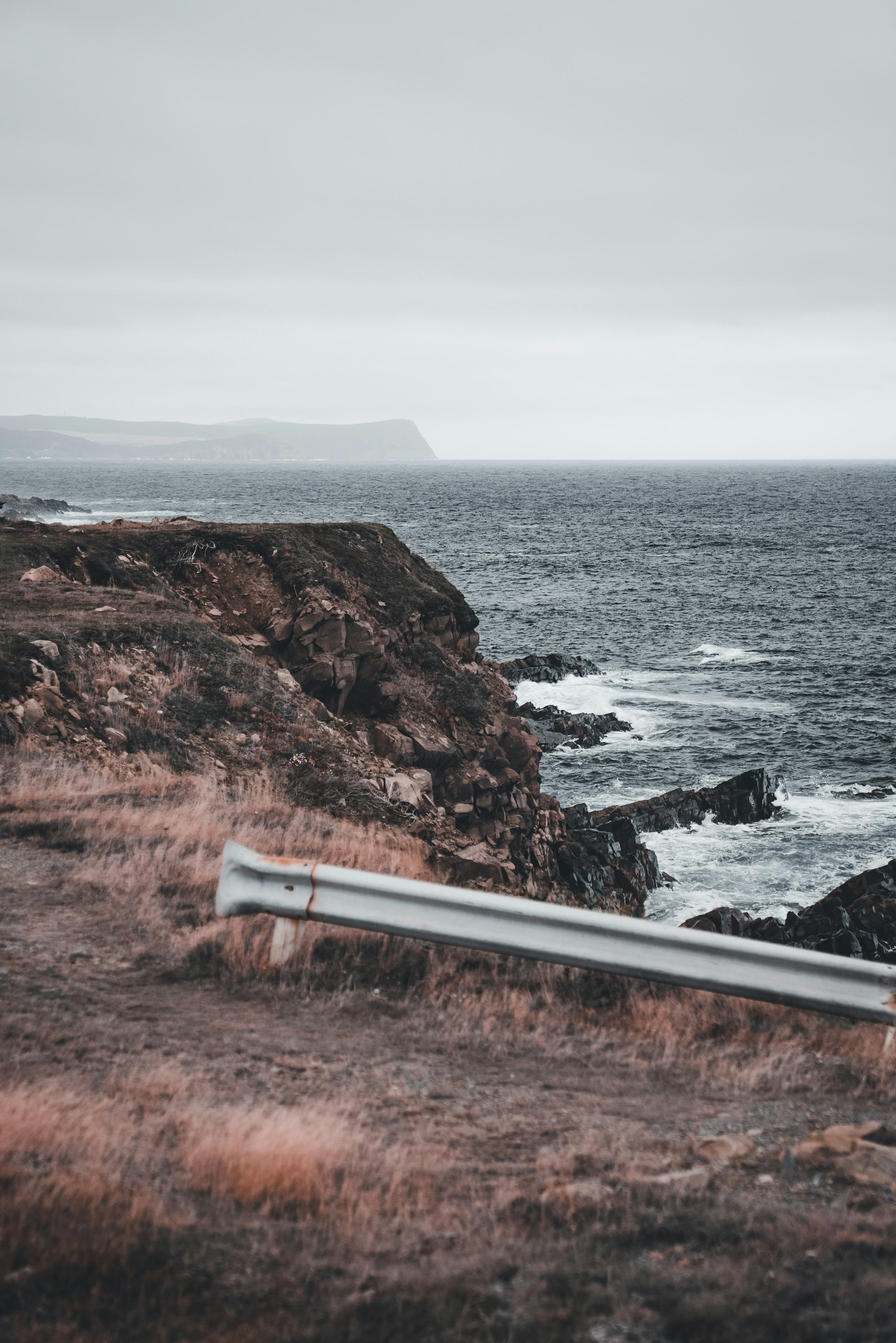 Rugged Cliffs Meet the Sea Under a Gray Dusk