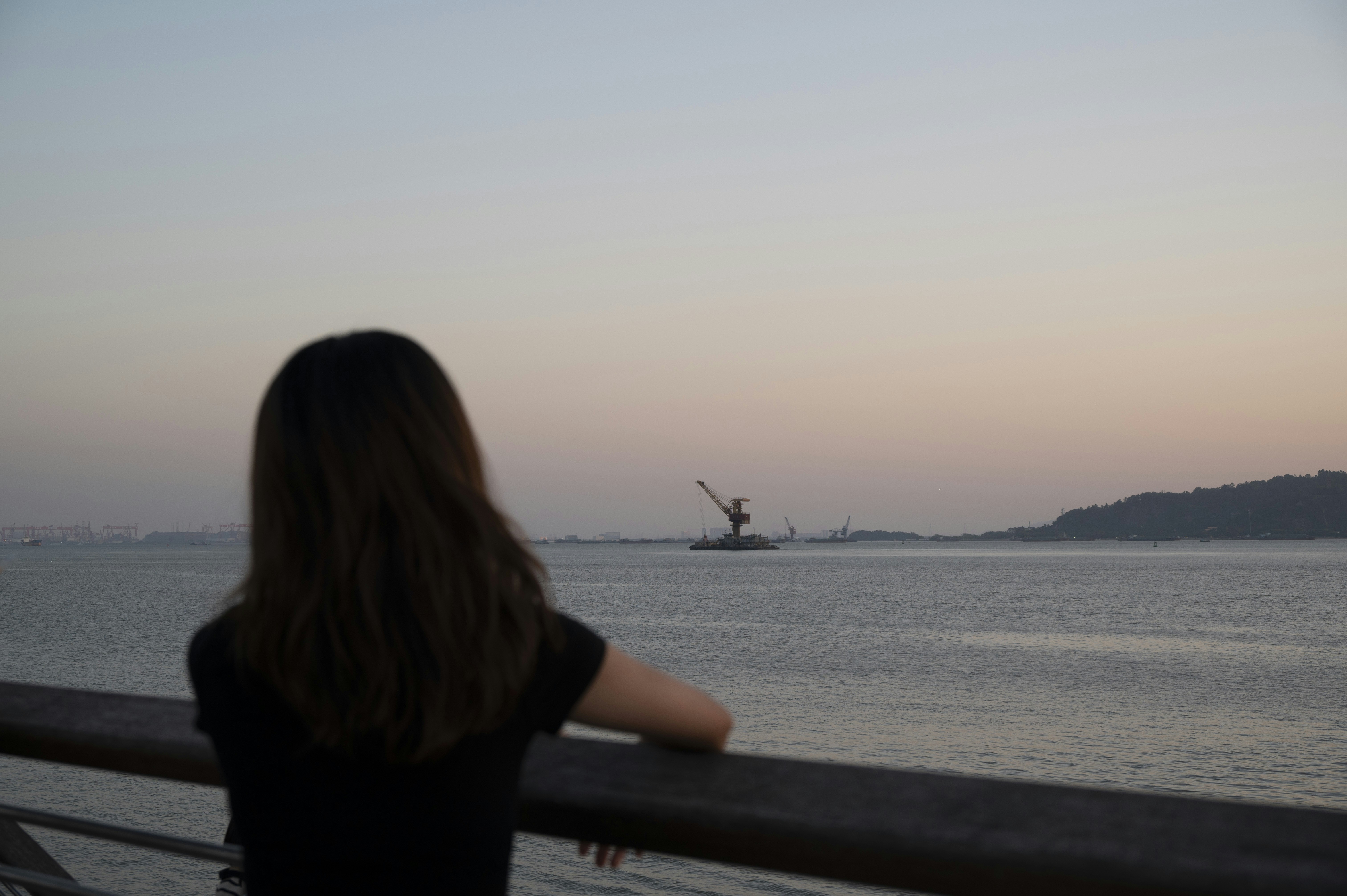 A woman looking out over a body of water