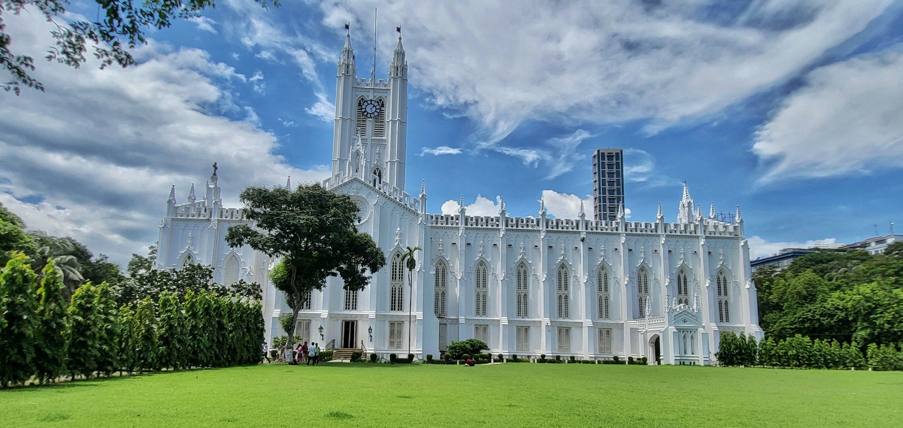 A large white building with a tall tower photo – Free Building Image on ...