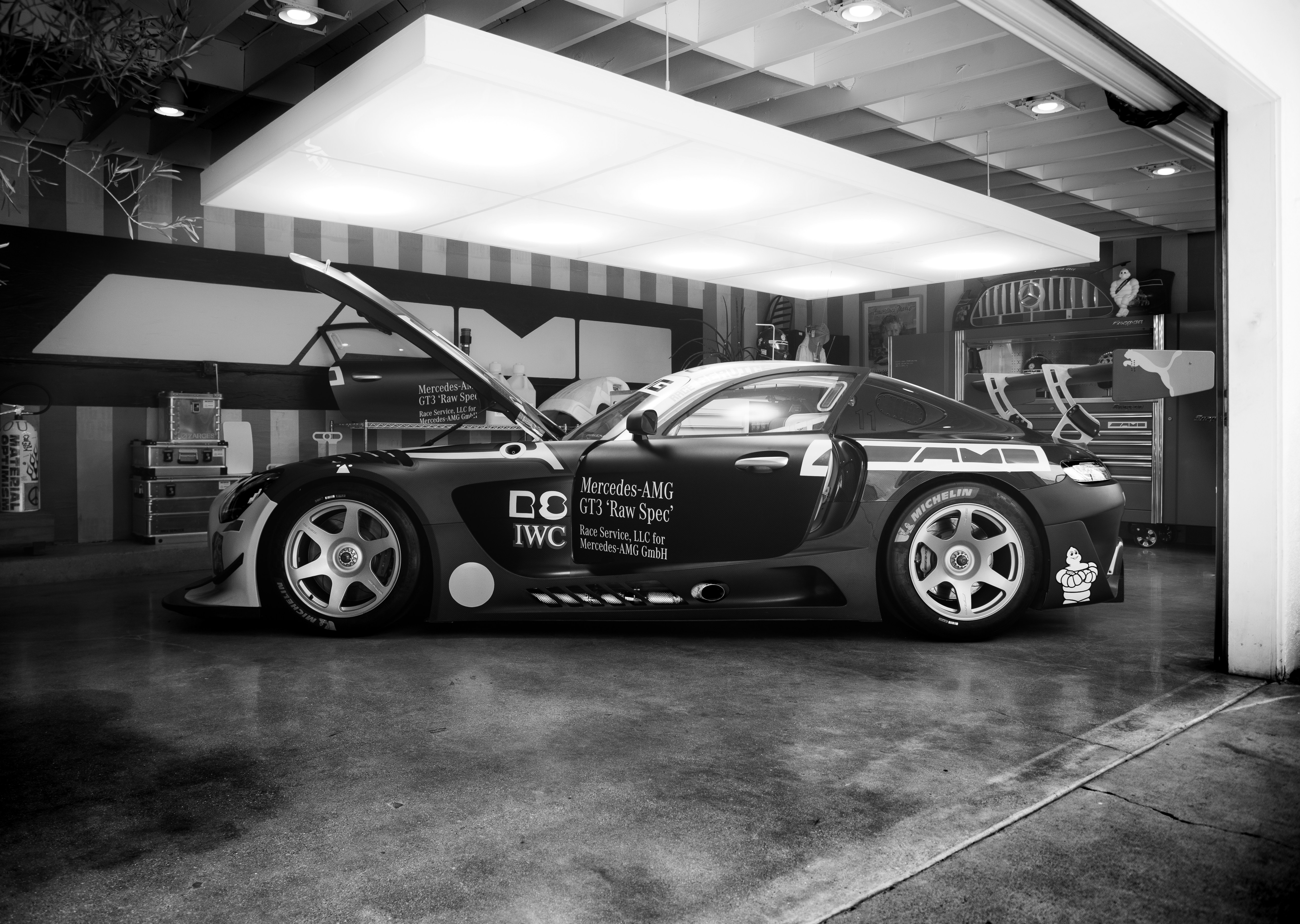 Under the Hood: A Gleaming Race Car in a Neon-Accent Garage