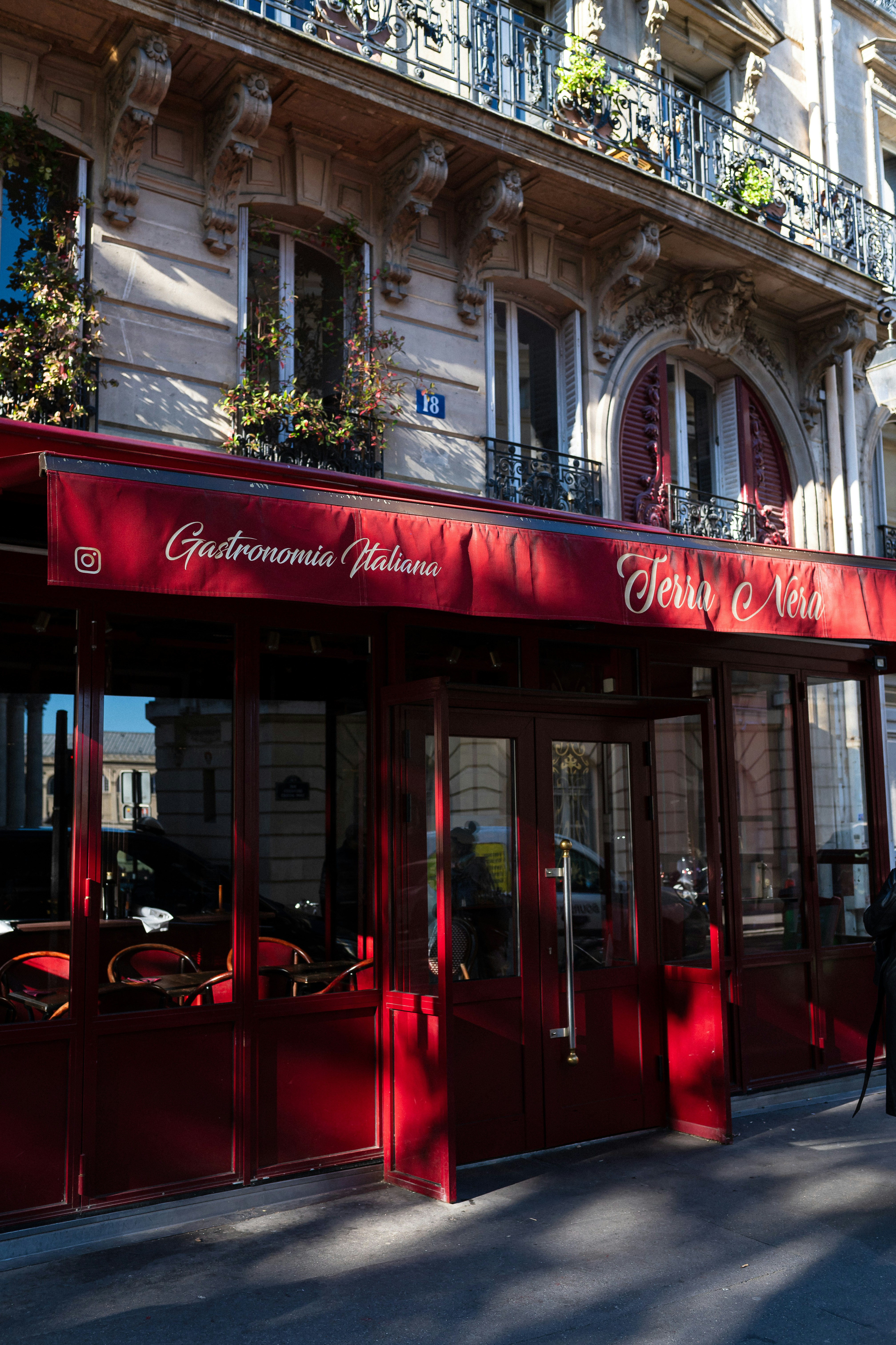 Terra Nera: The Velvet Red Threshold of a Parisian Bistro
