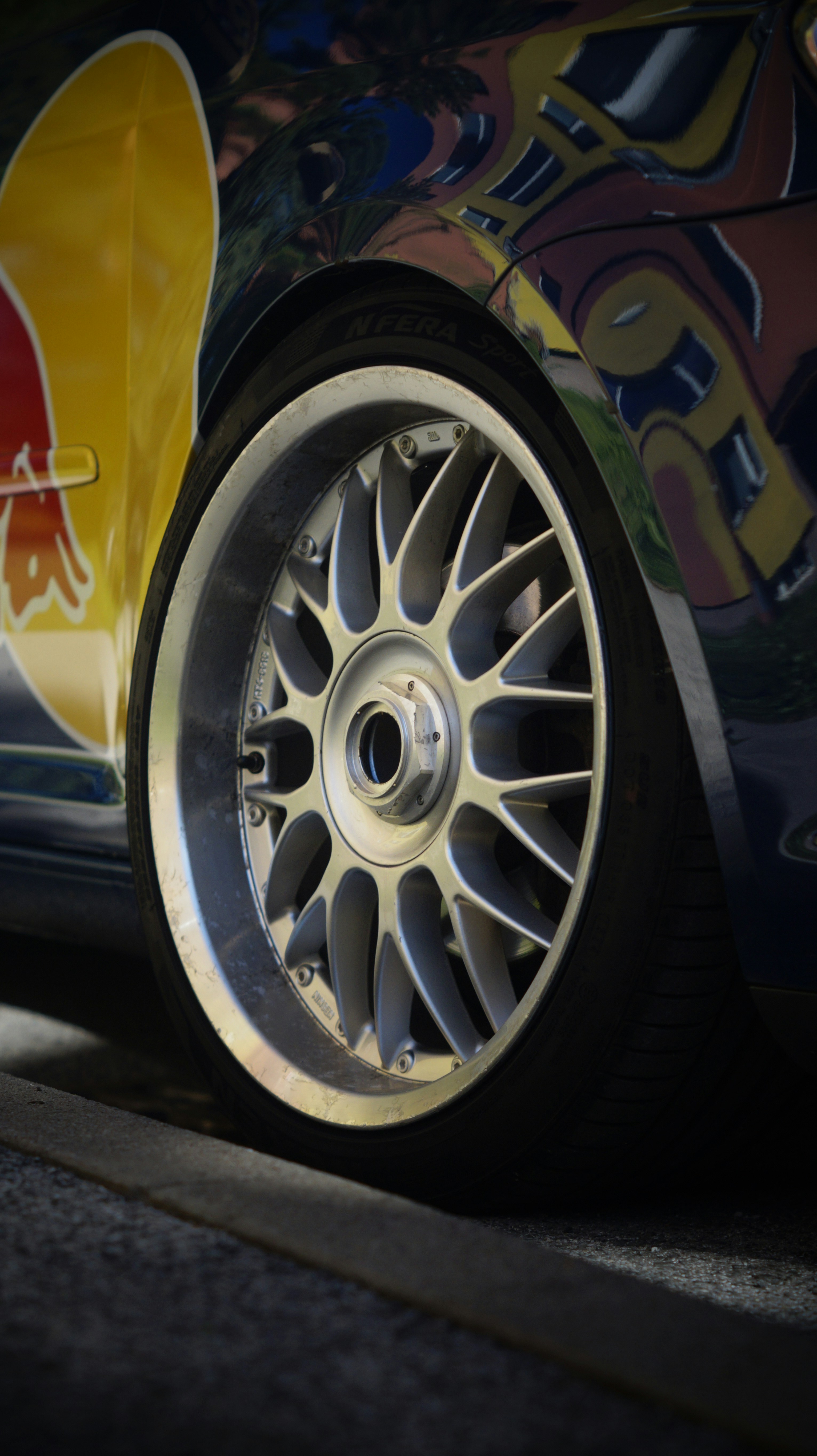 Grimace on the Rim: A Vivid Wheel with Cartooned Reflections
