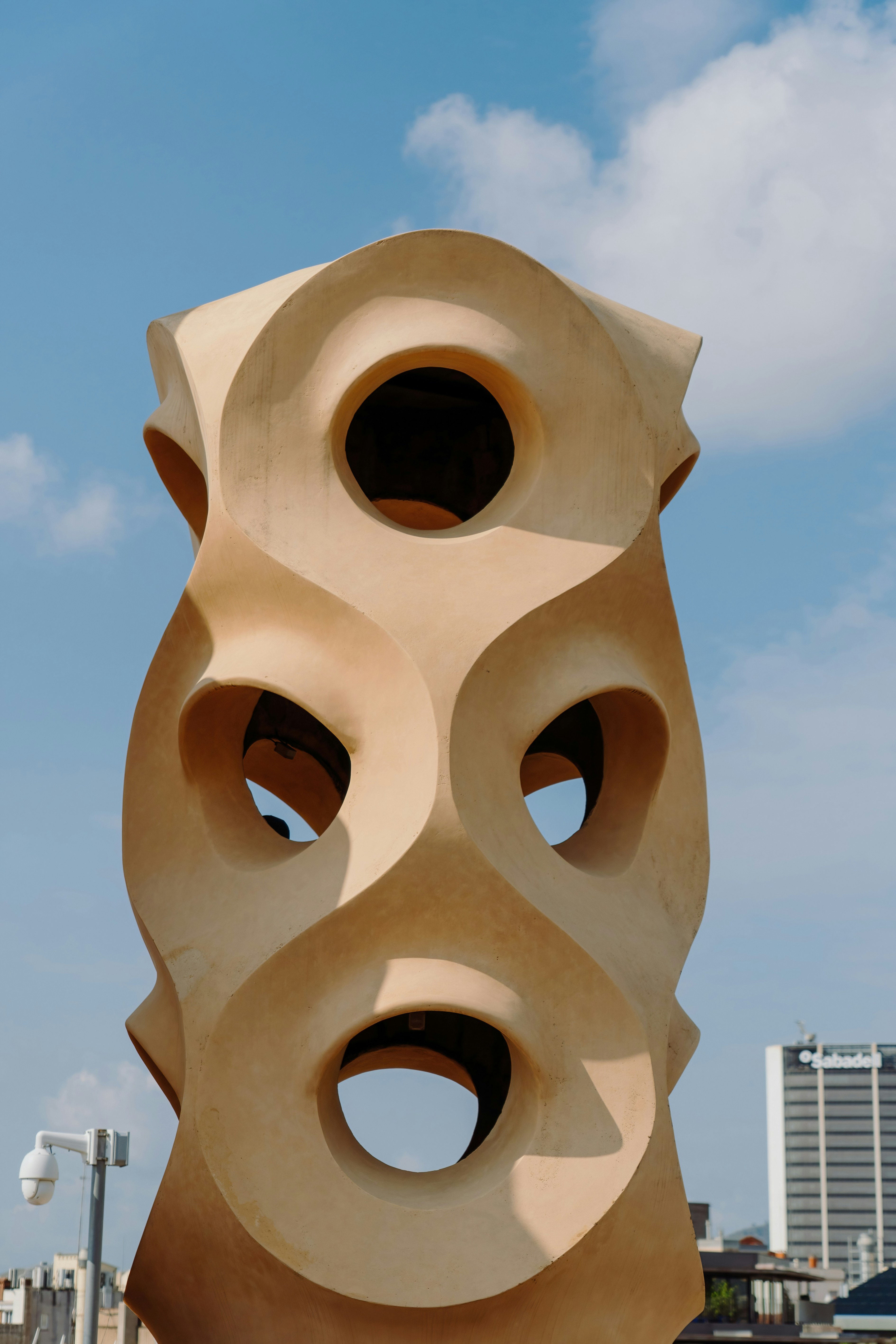 Skyward Orbs: A Sculptural Tower of Circular Voids