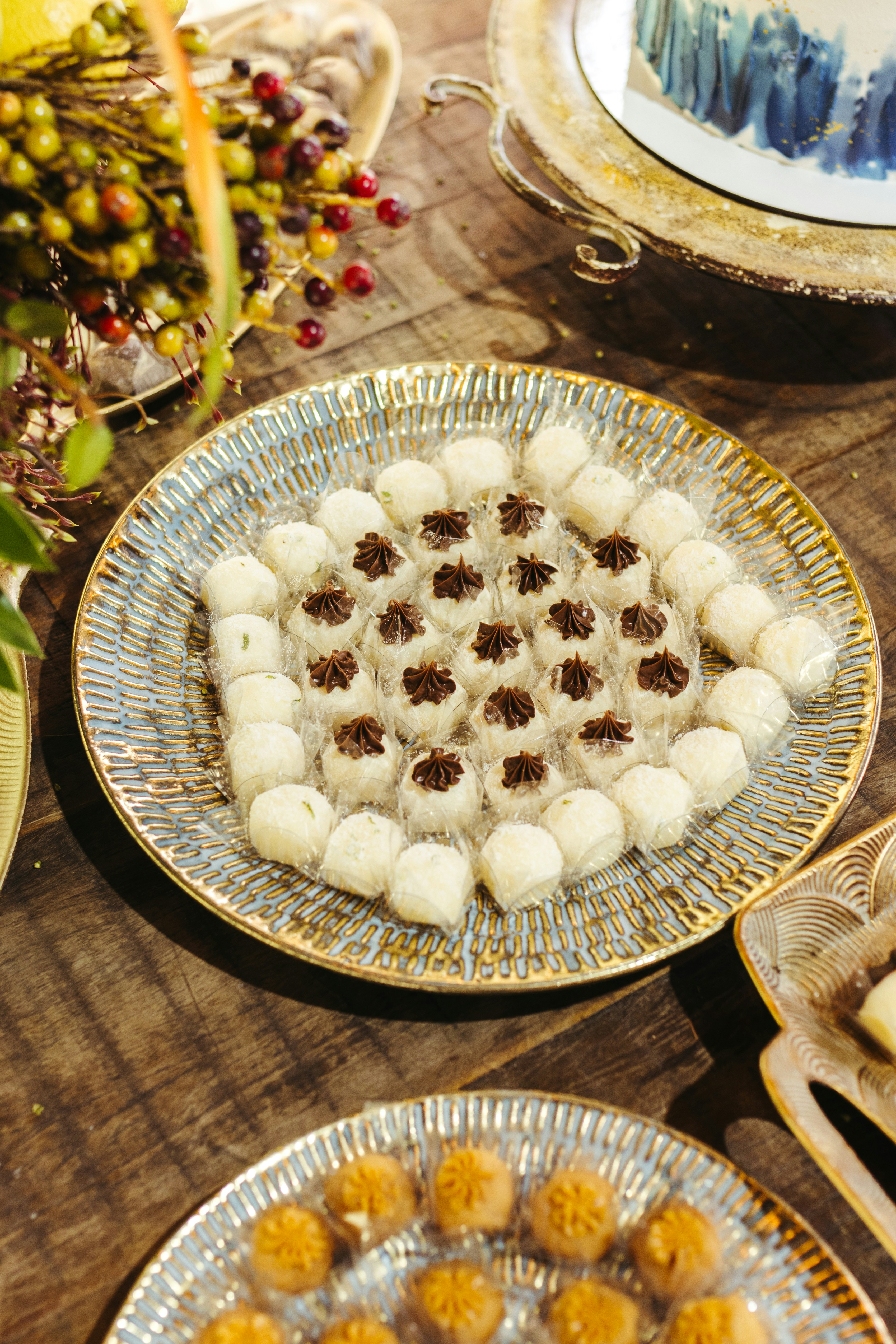 Ring of White Truffles Adorned with Star Anise on a Rustic Blue Plate