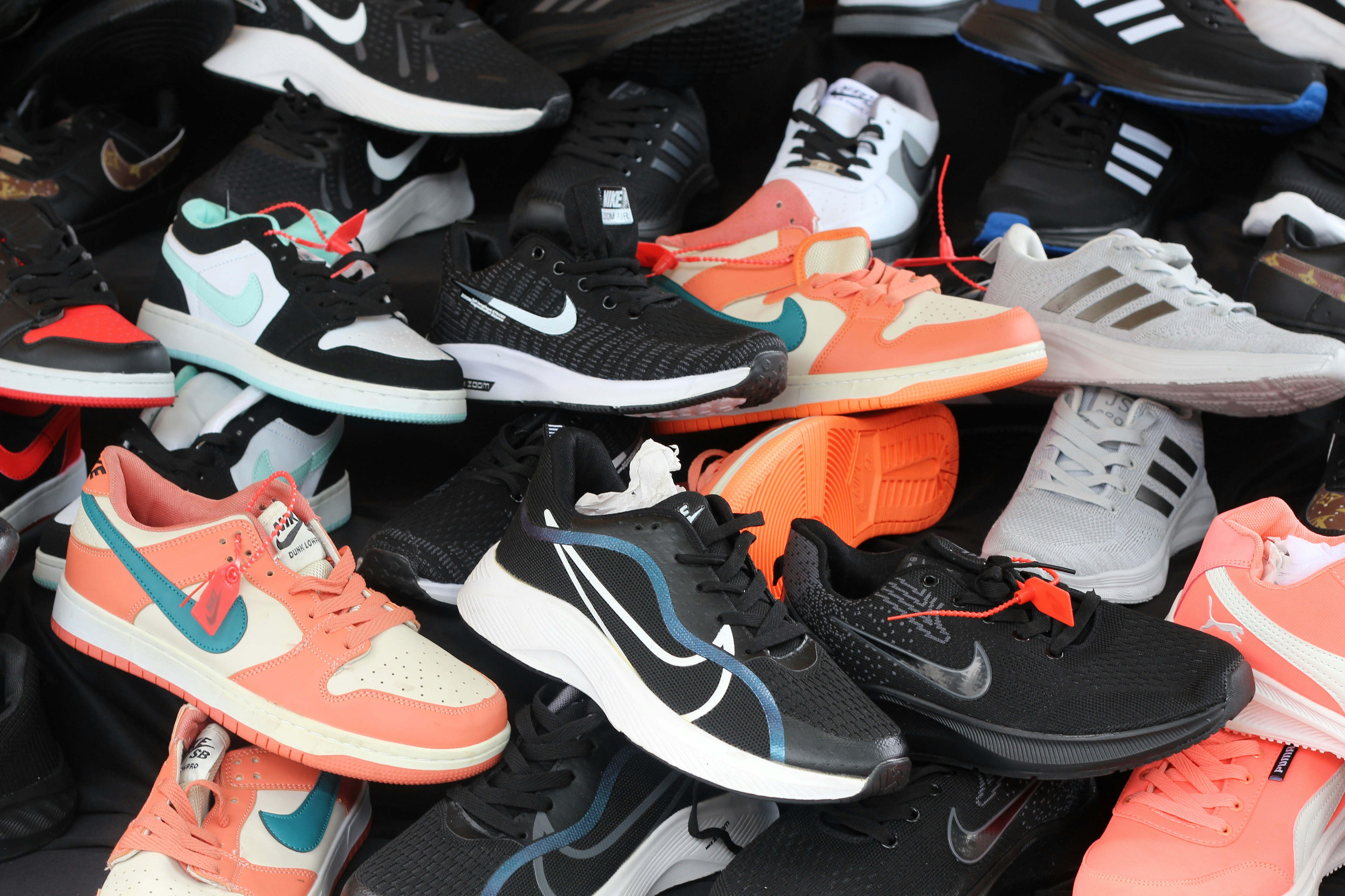 A pile of shoes that are all different colors photo – Free Shoe Image ...