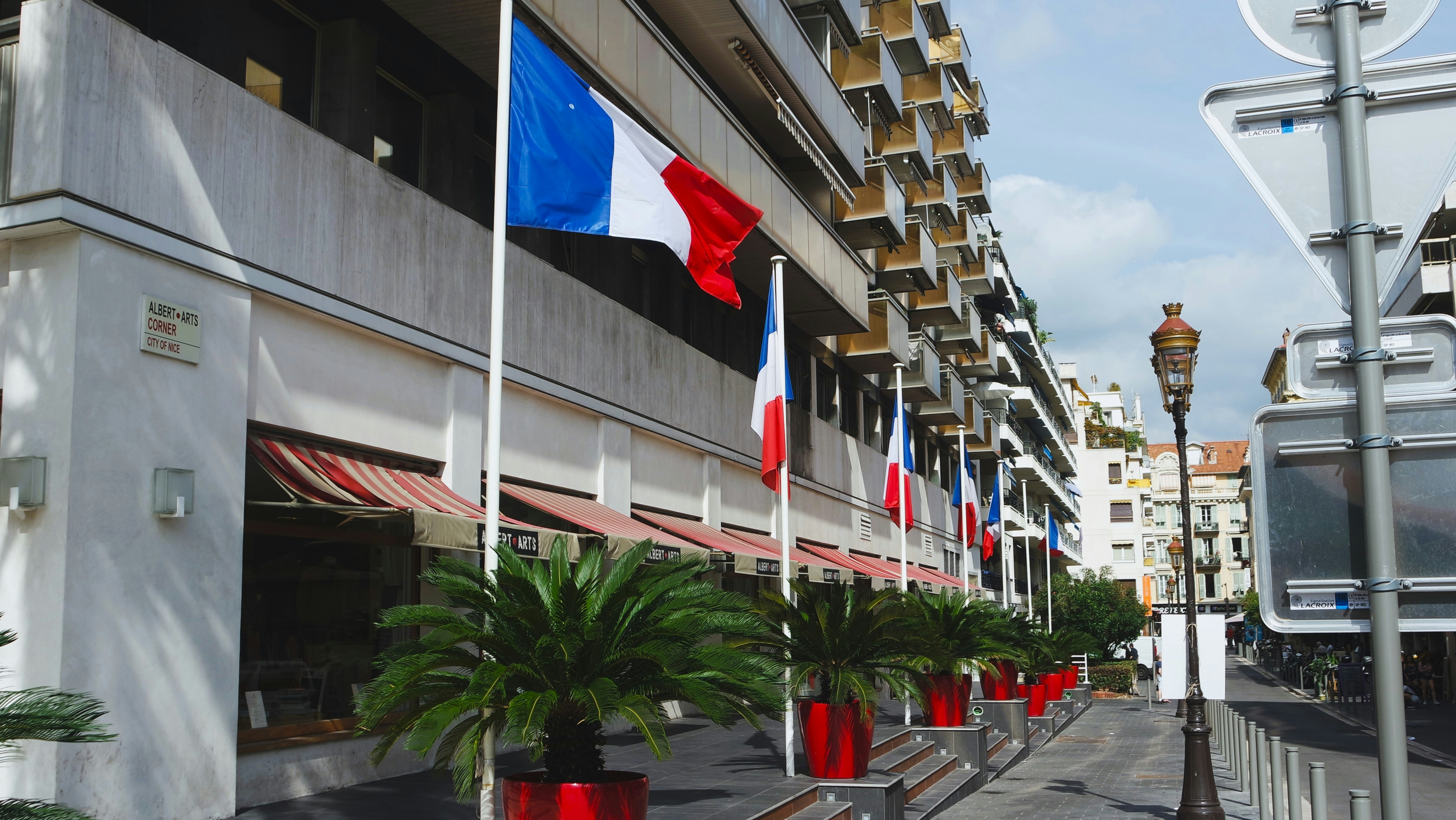 Flag-Lined Promenade Under a Modern Arcade