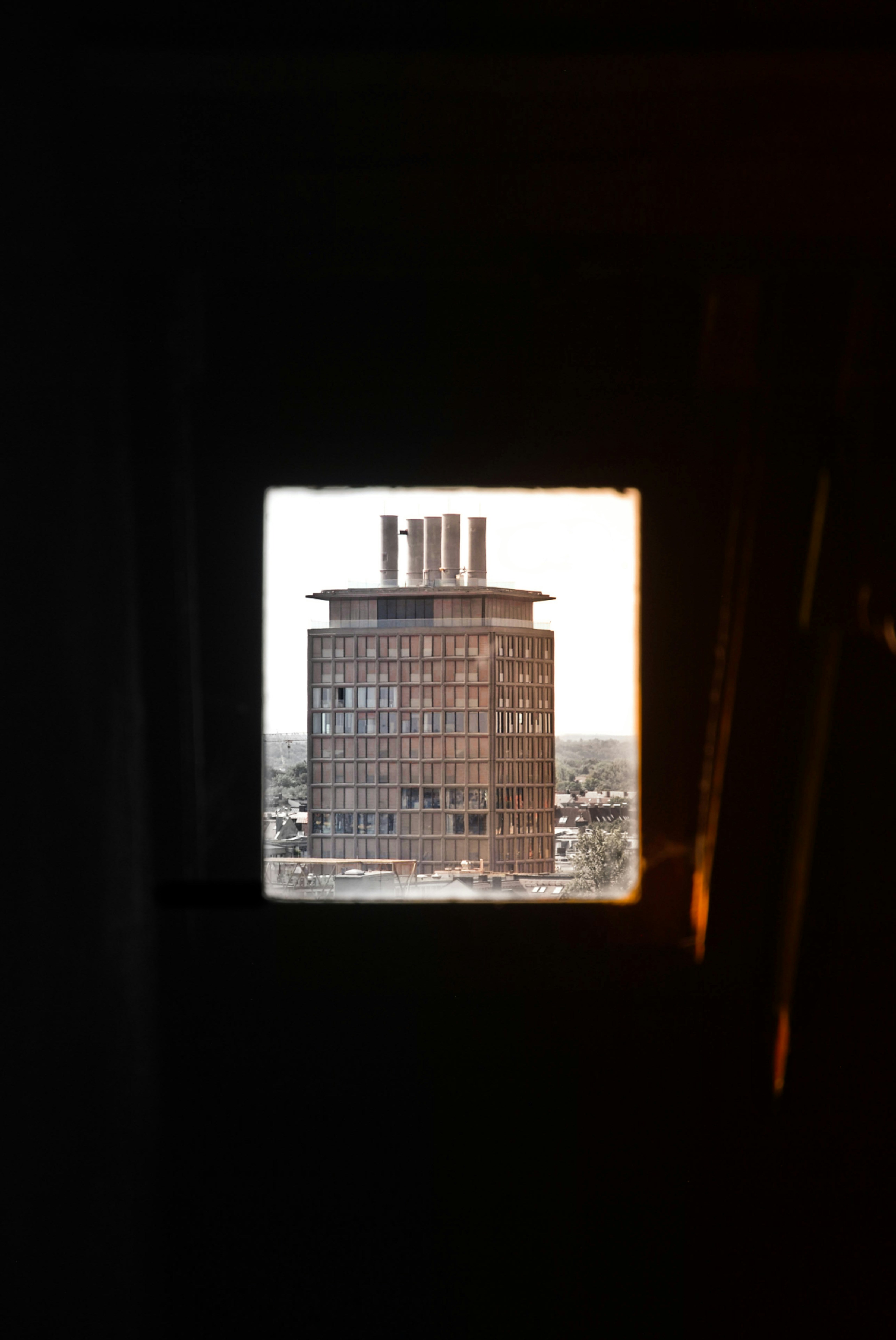 A view of a building through a window photo – Free Building Image on ...
