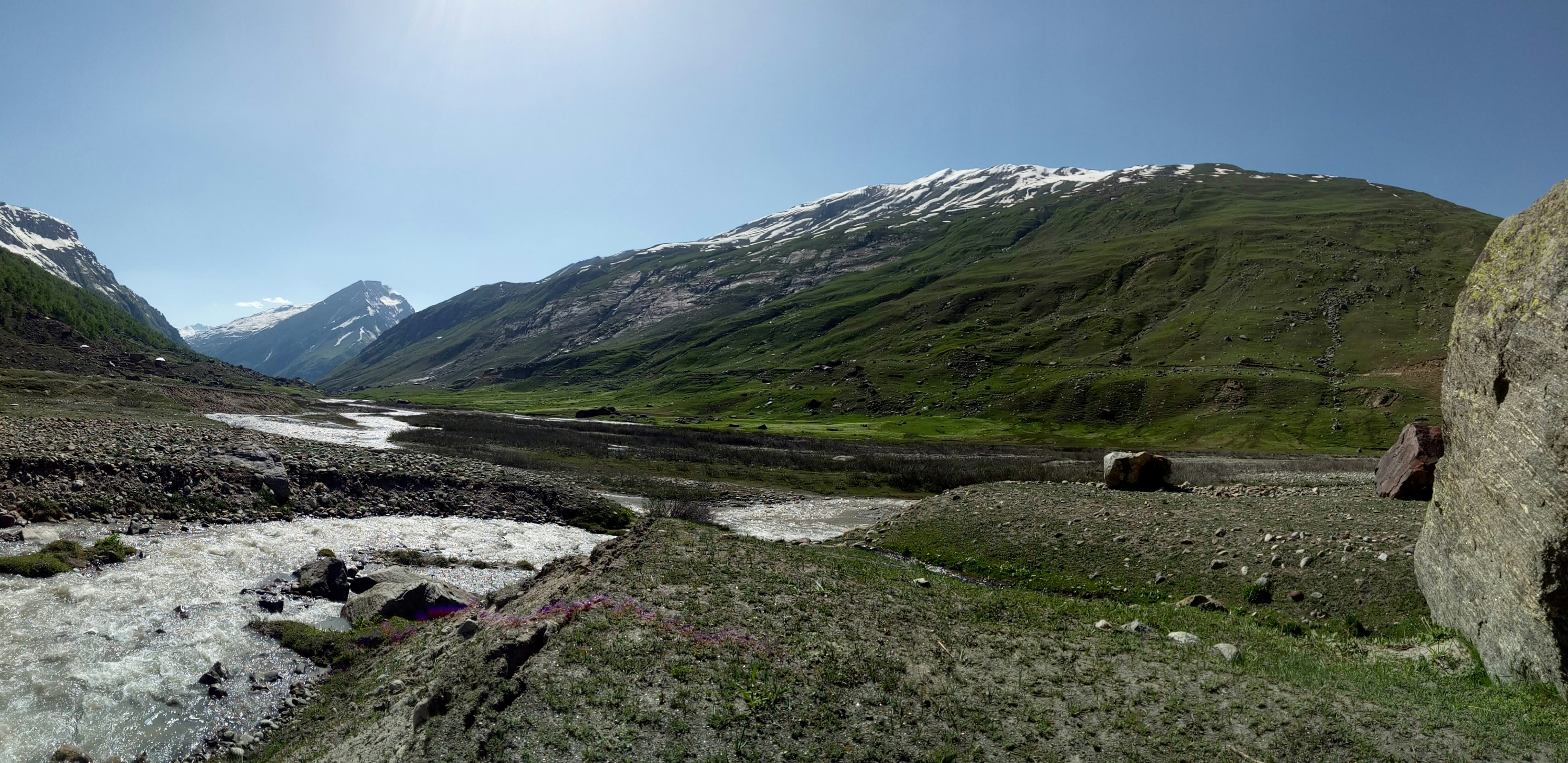 A mountain valley with a river running through it photo – Free Shounter ...